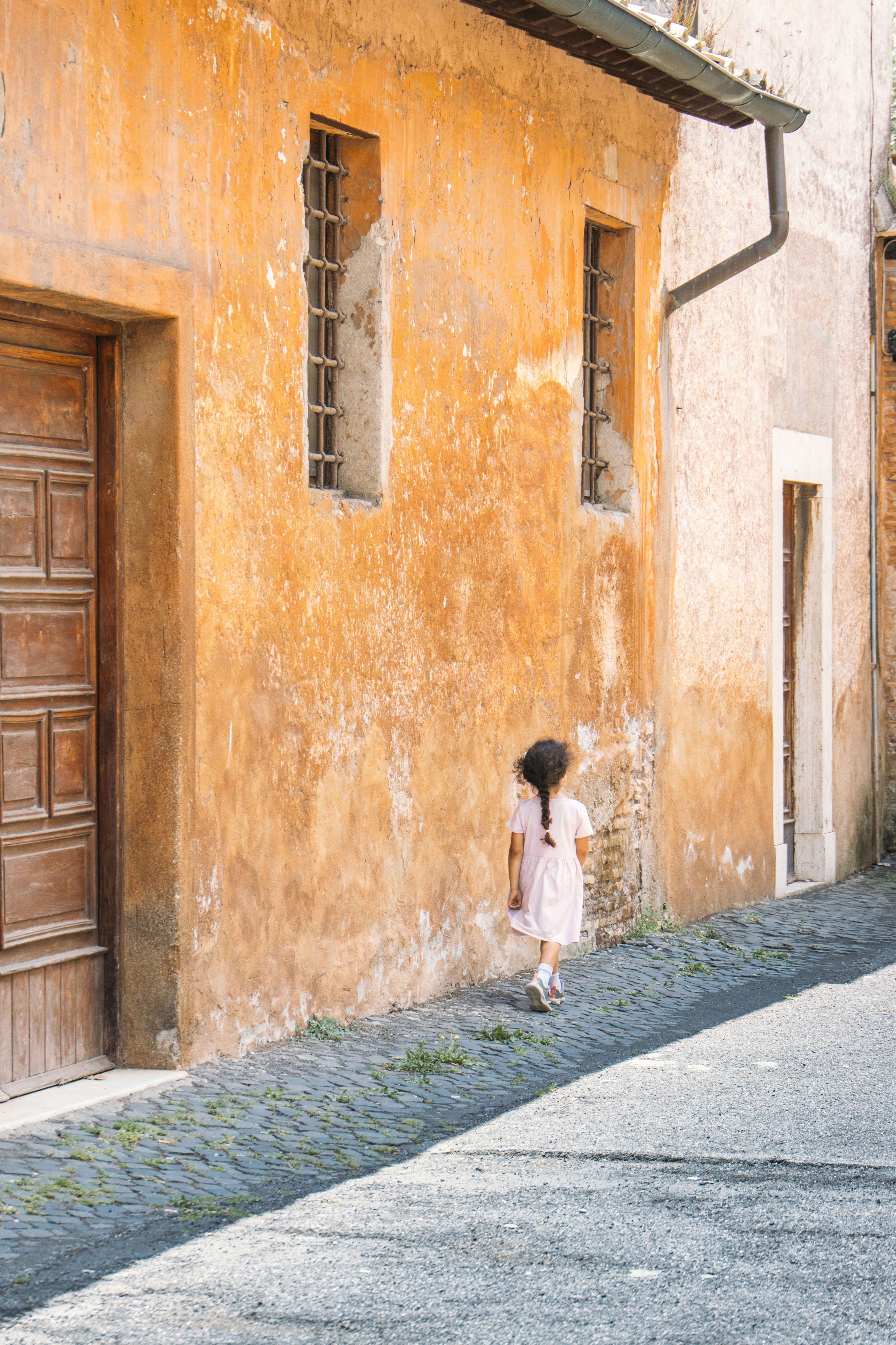 Child in Peach Wall Alley