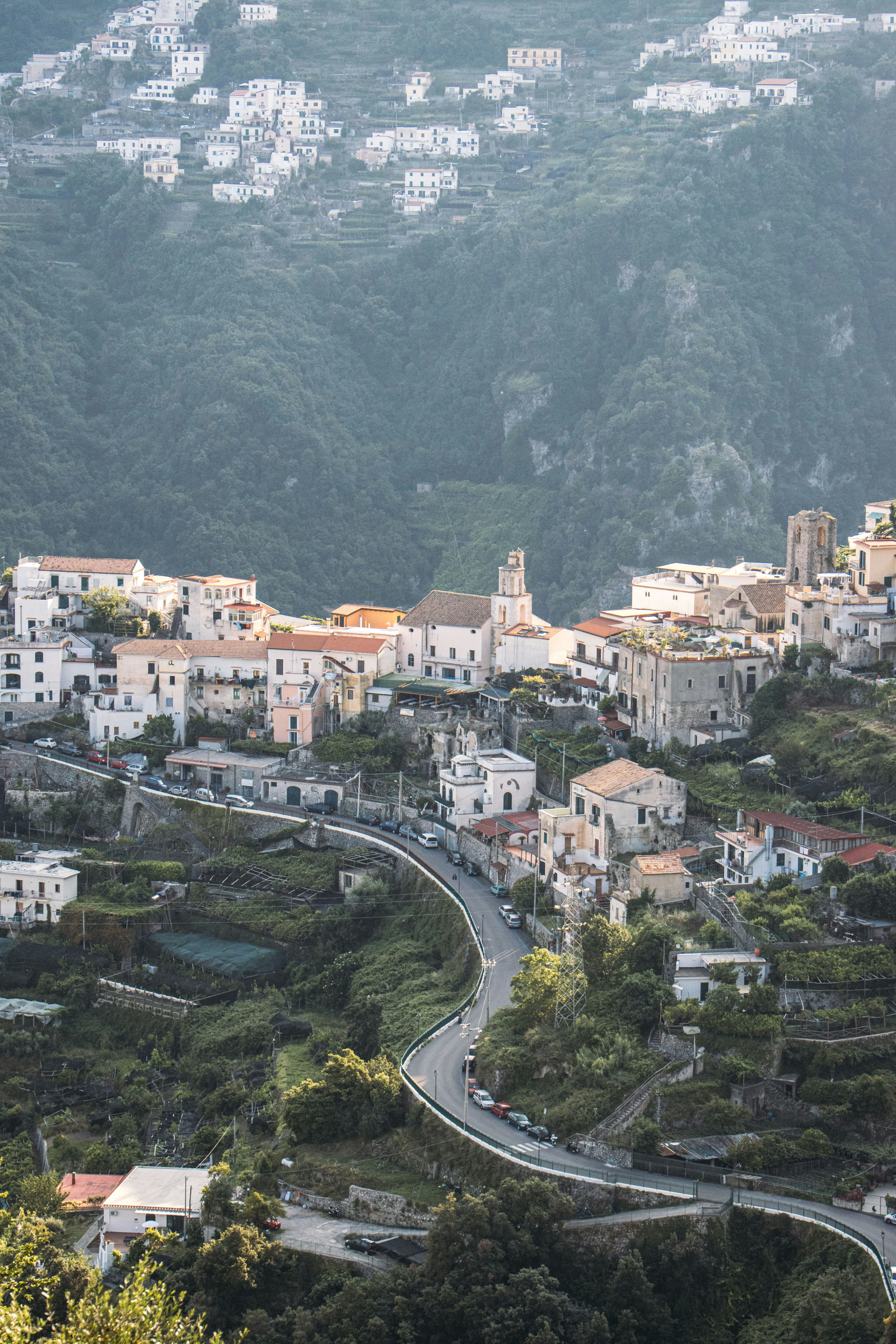 Winding coastal village climbs a sunlit hillside