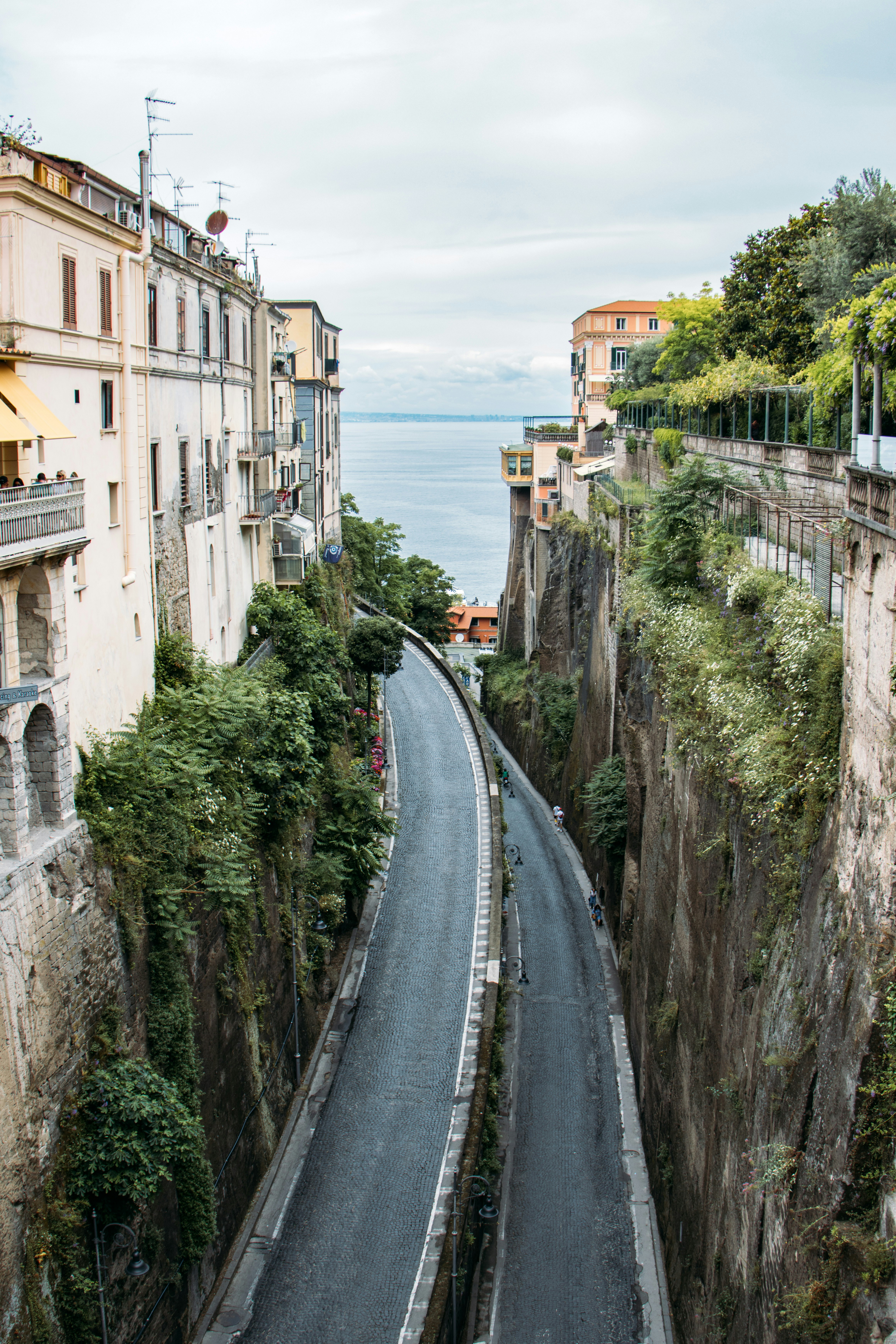 A Streetcar in the Gorge: Buildings, Road, and Sea Beyond