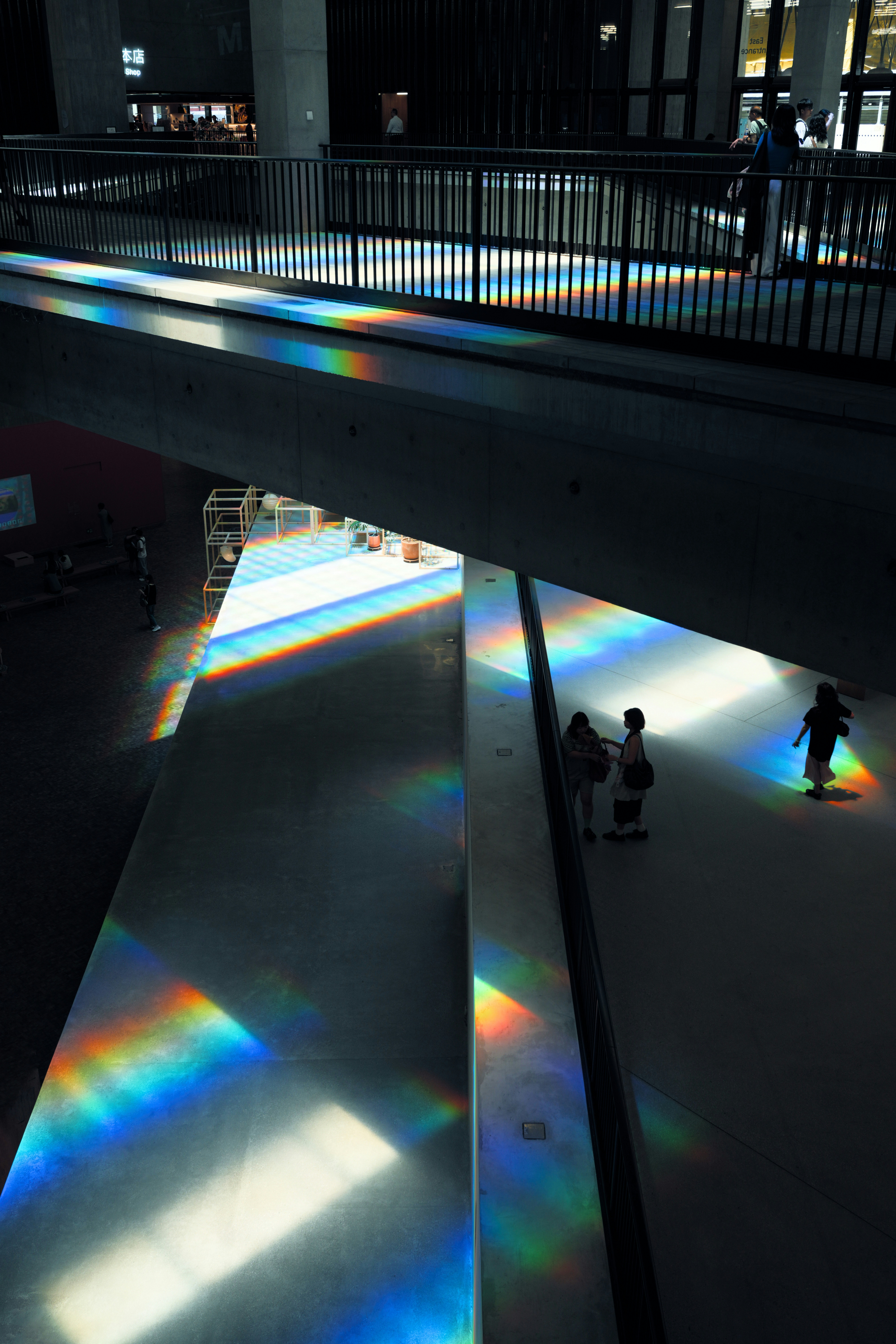 Prismatic Walkway: Rainbow Light Dunes in the Public Atrium