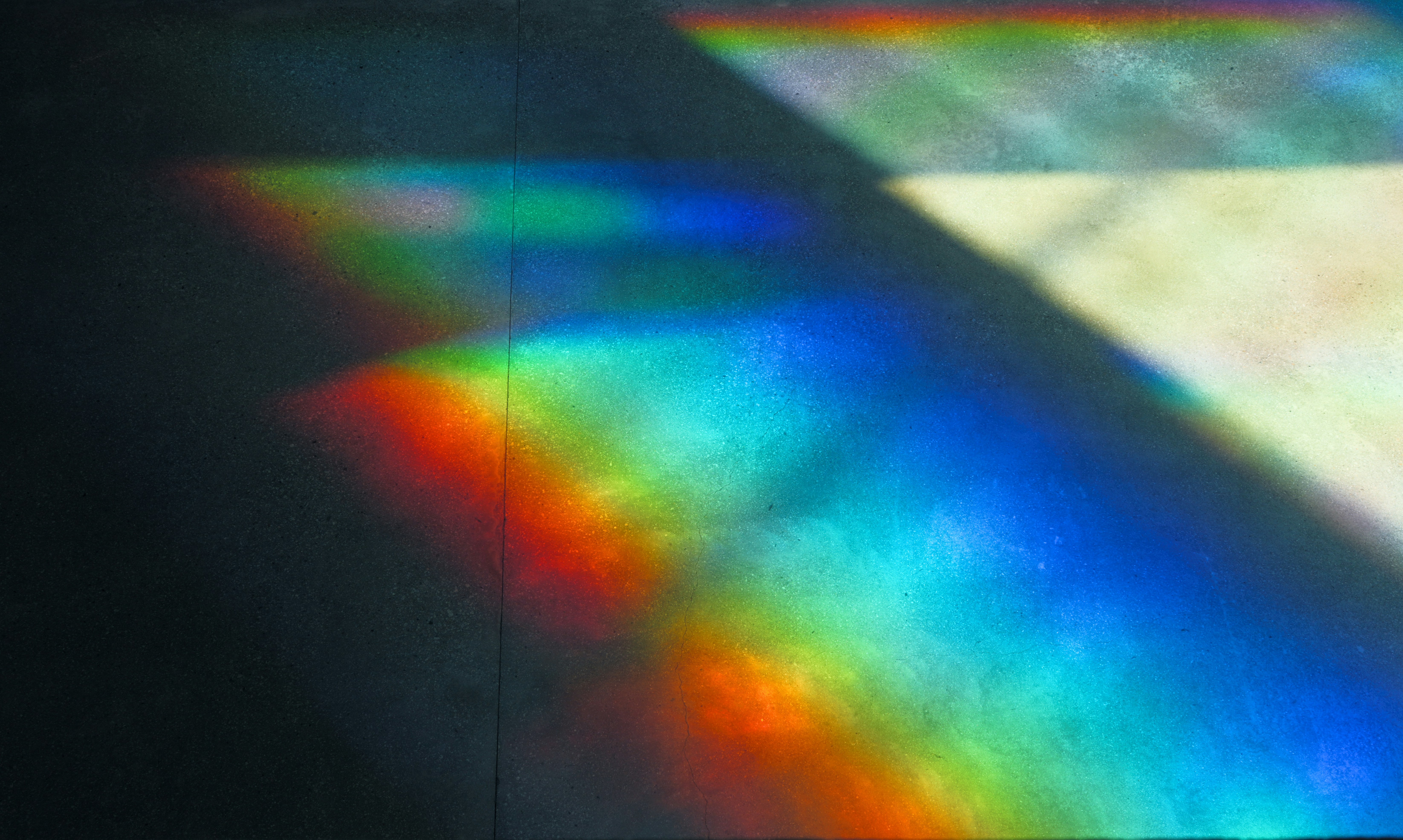 Prismatic Light: Rainbow Glint Across a Dark Plane