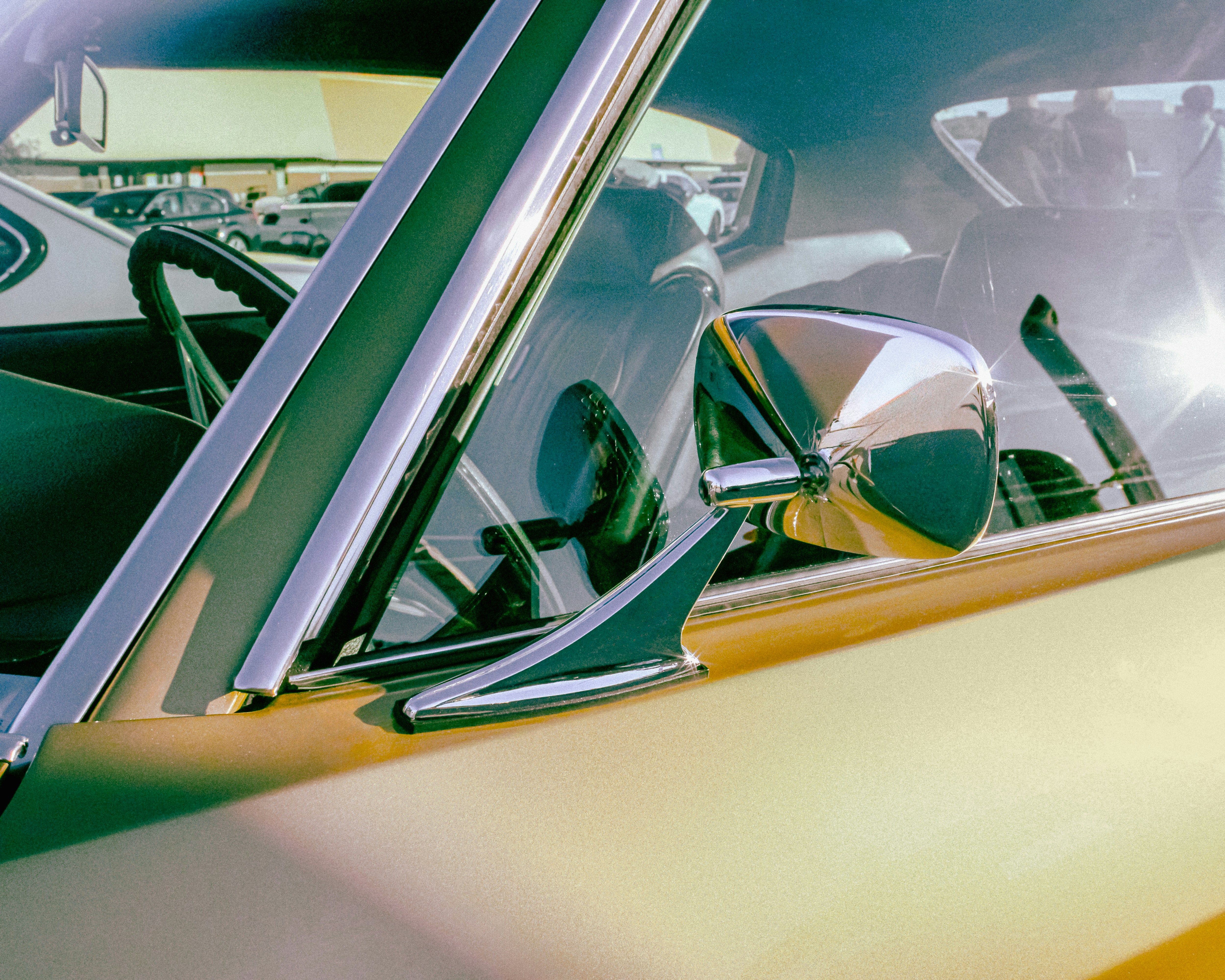 Chrome Reflections: A Glimpse of a Classic Car’s Side Window
