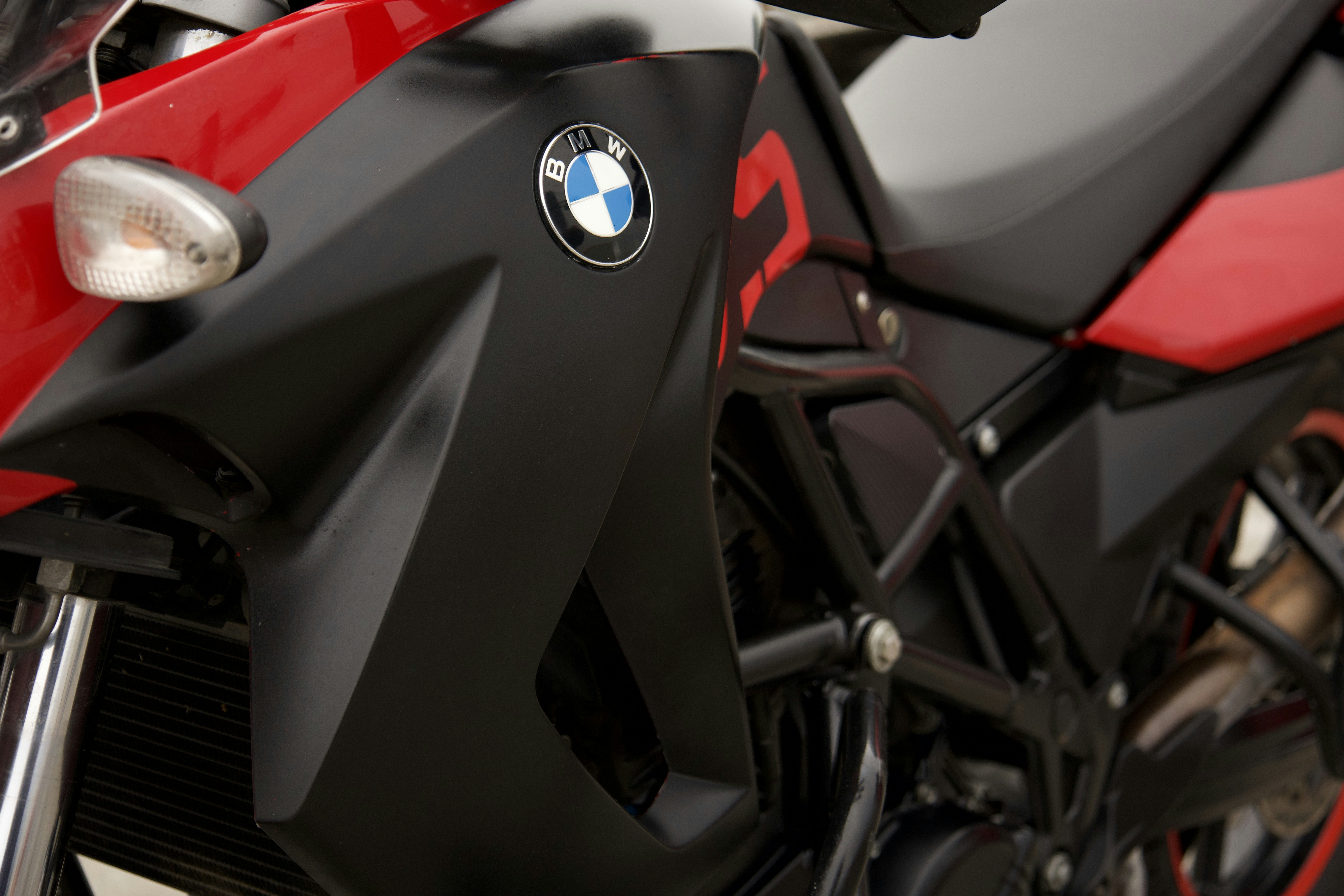Front-frame Focus: BMW Motorrad Emblem and Red SportBike Profile