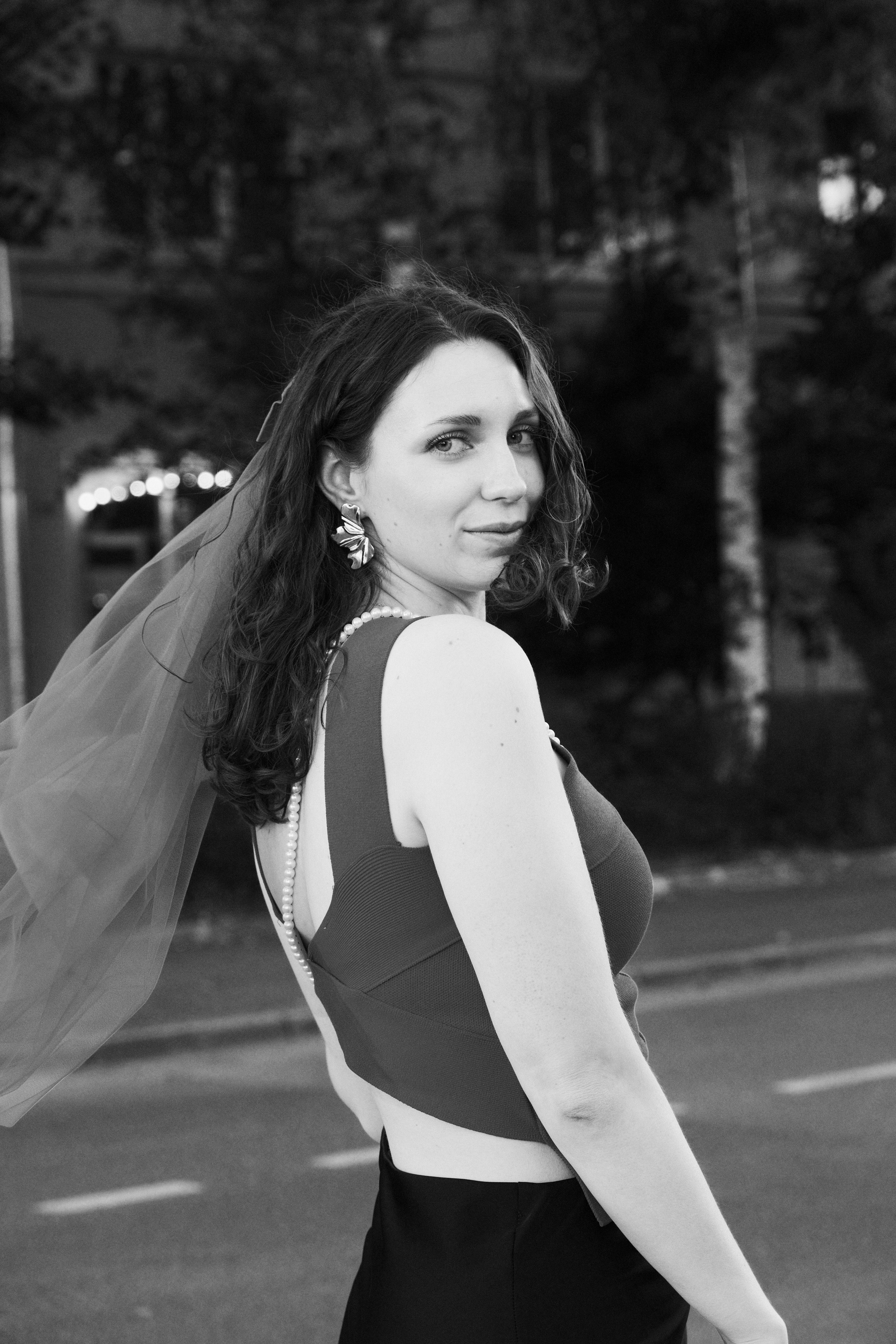 Bride in Backlit Evening Veil Turns Portrait