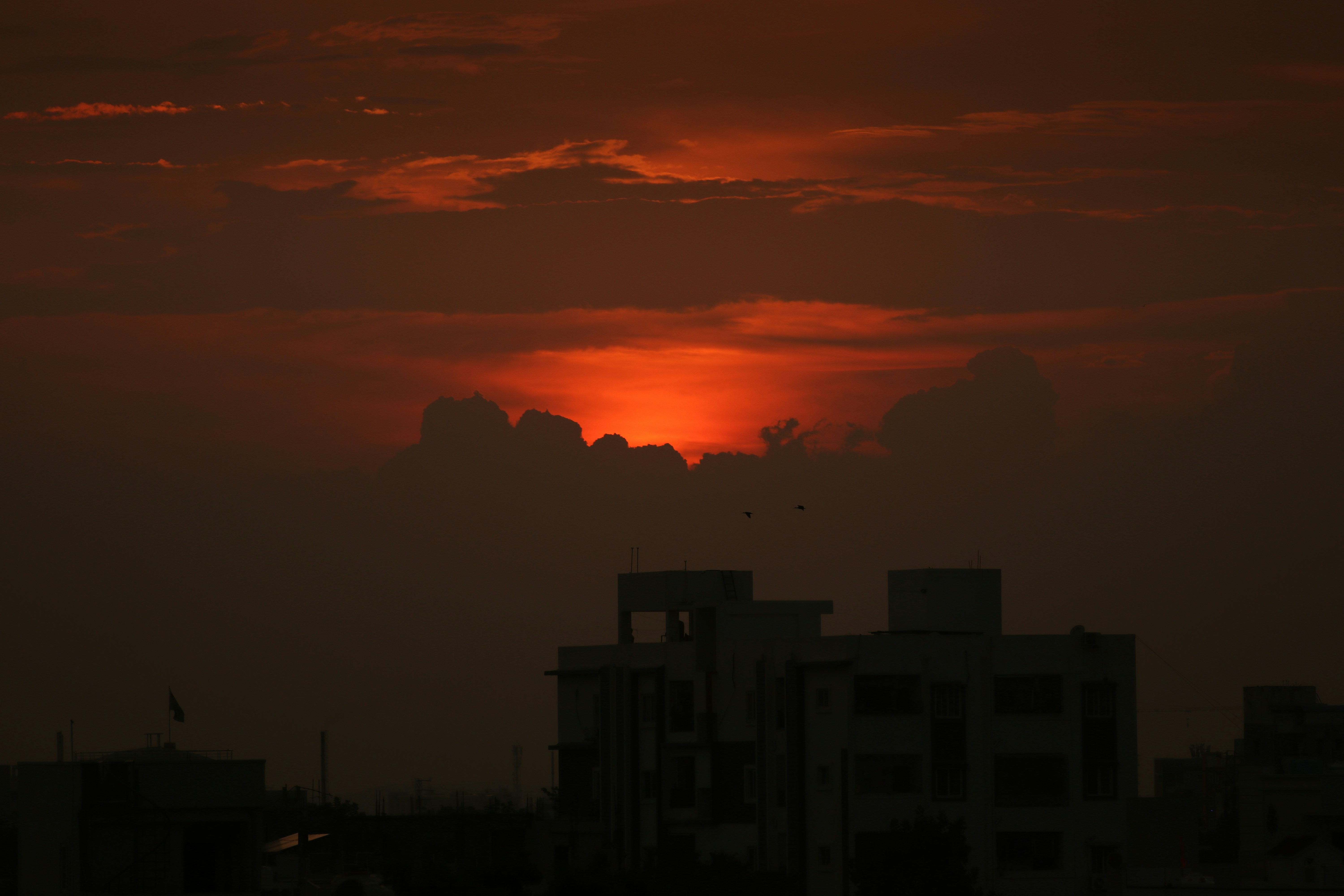 Crimson Horizon Behind Silent Rooftops