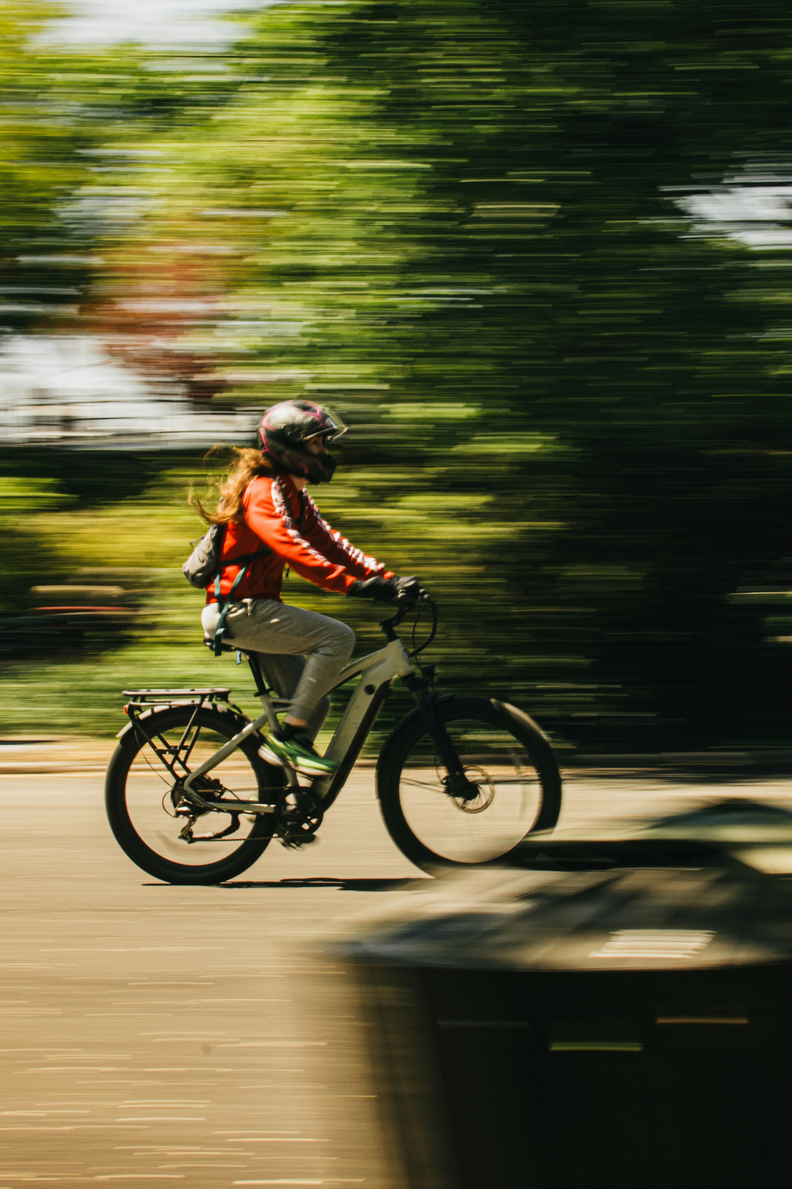 Red-Jacket Rider in Motion: A City Ride Blur