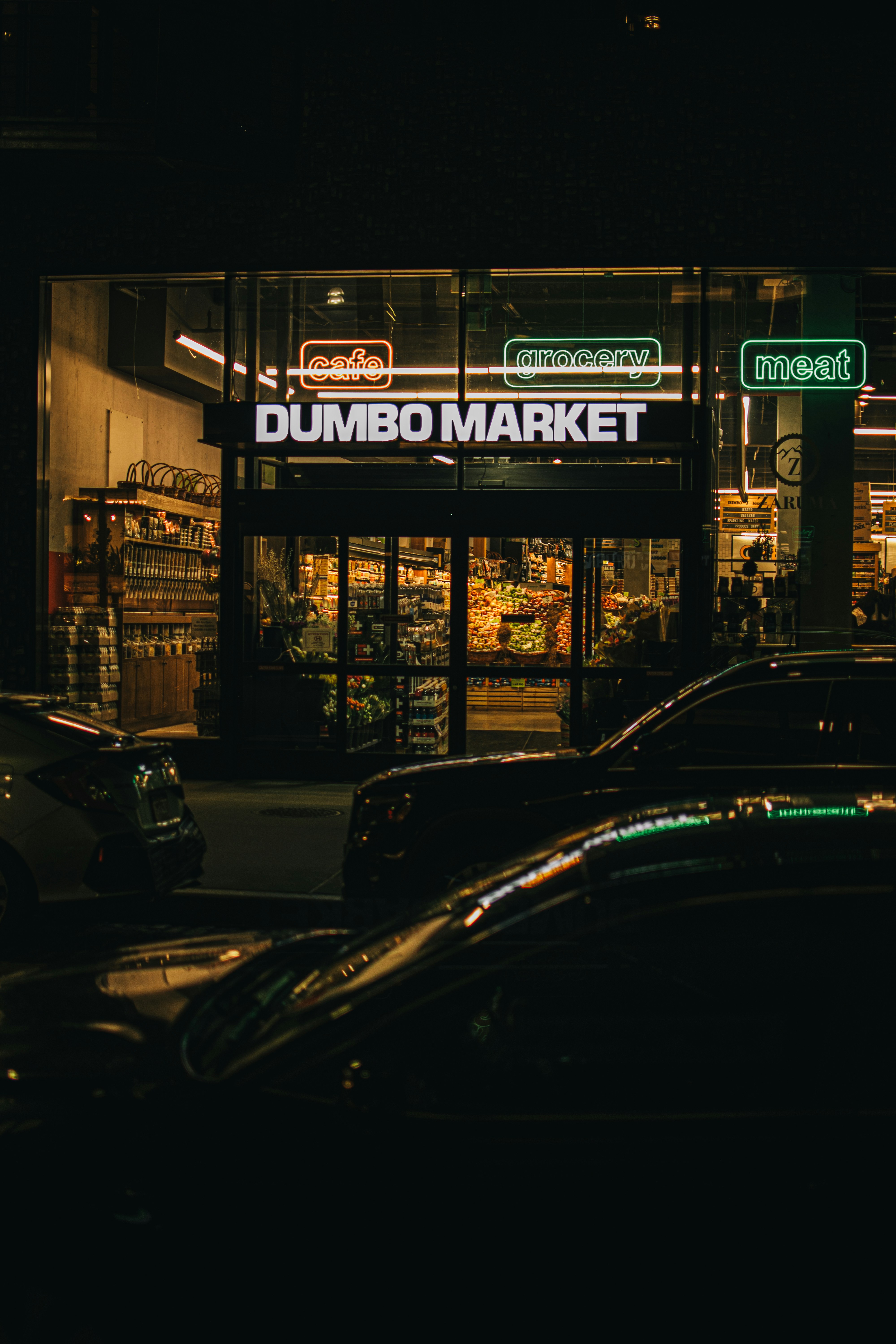 Dawn of Dumo: Neon Signage Framing a Quiet Market