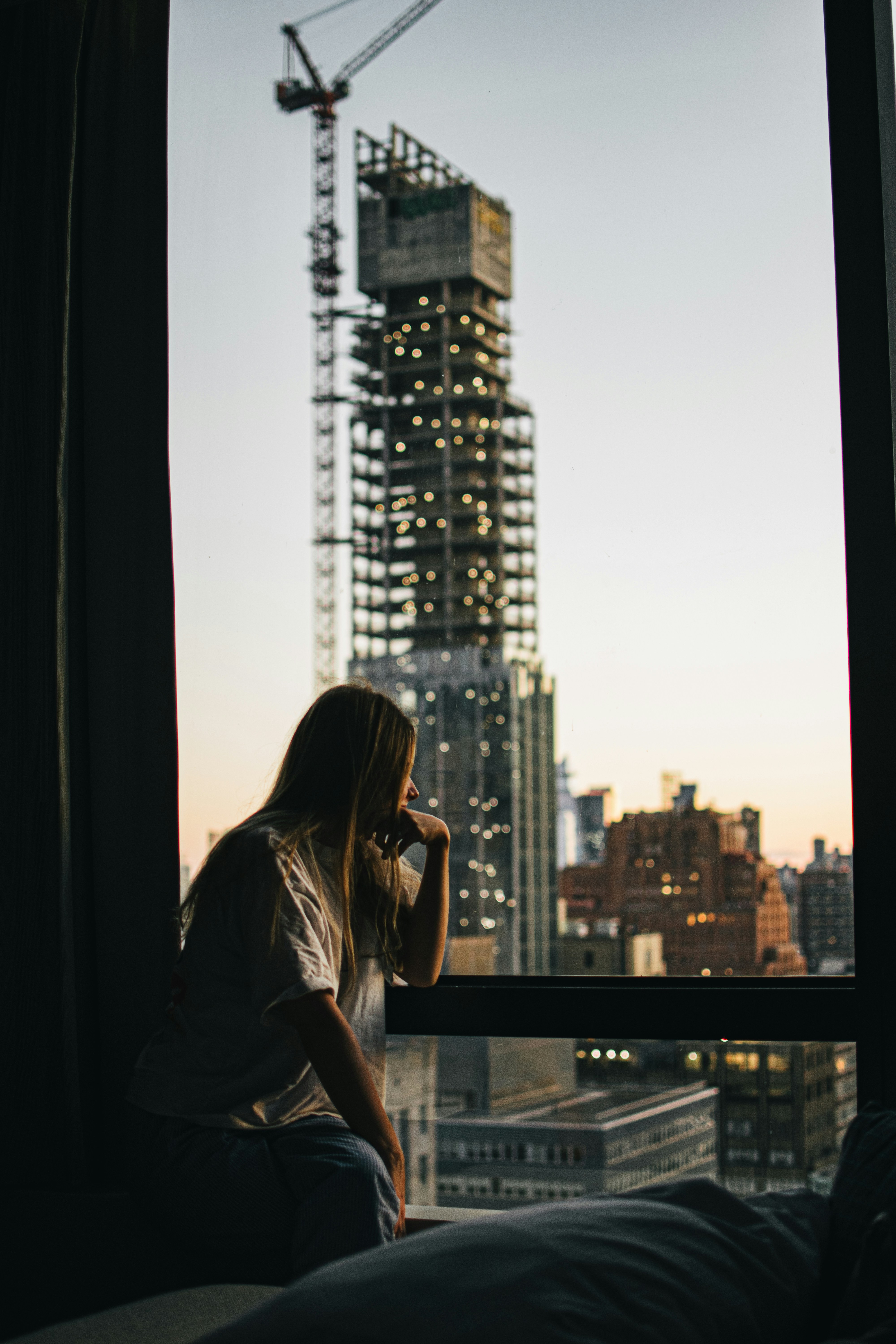 Cityscape Reverie: A Quiet Moment by the Window