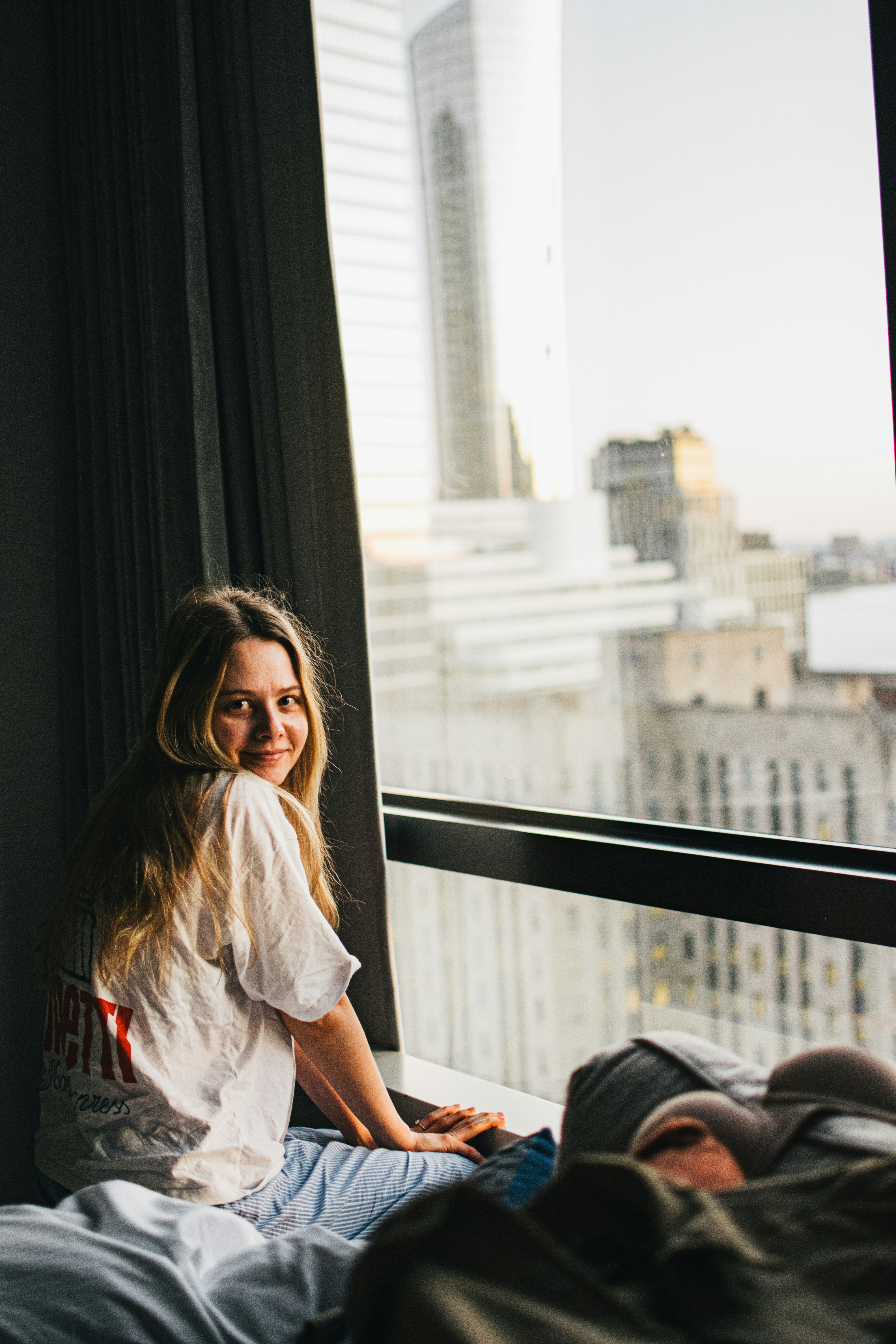 Windowside Portrait: A Moment of Warm Quiet in the City