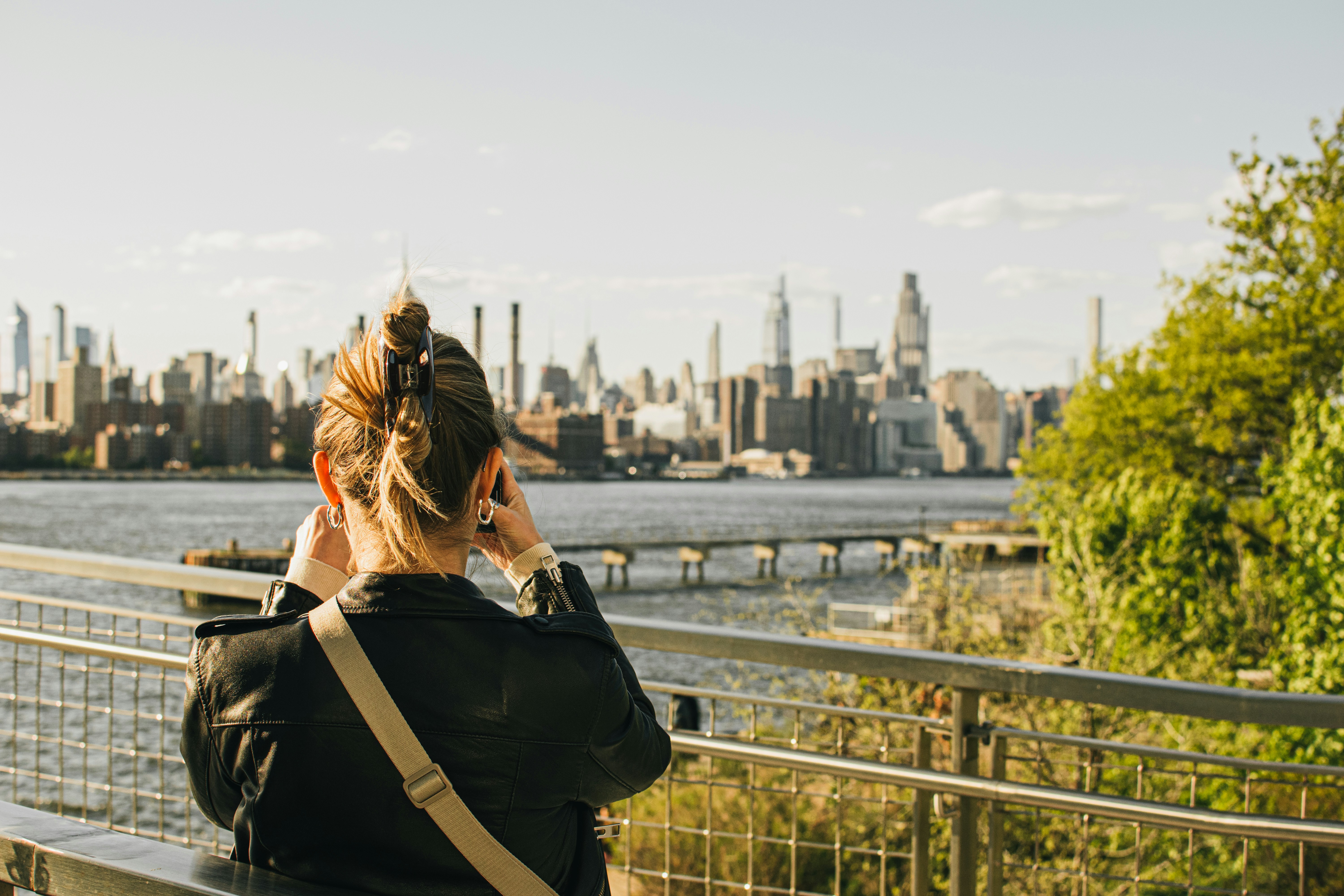 Cityscape Portrait: A Photographer’s Silhouette on the Waterfront
