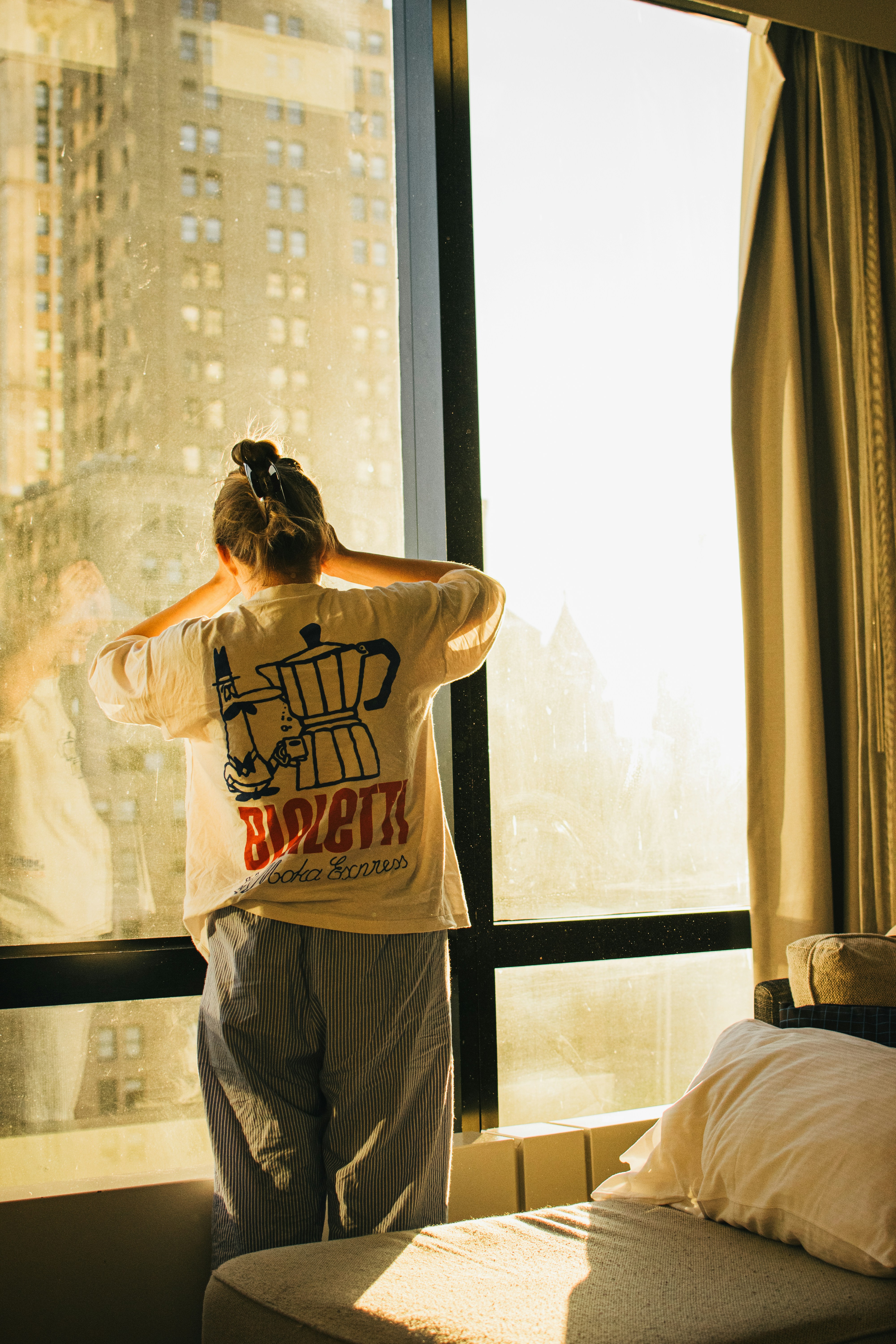 Rising to the Window: Morning Ritual in a Sunlit Studio