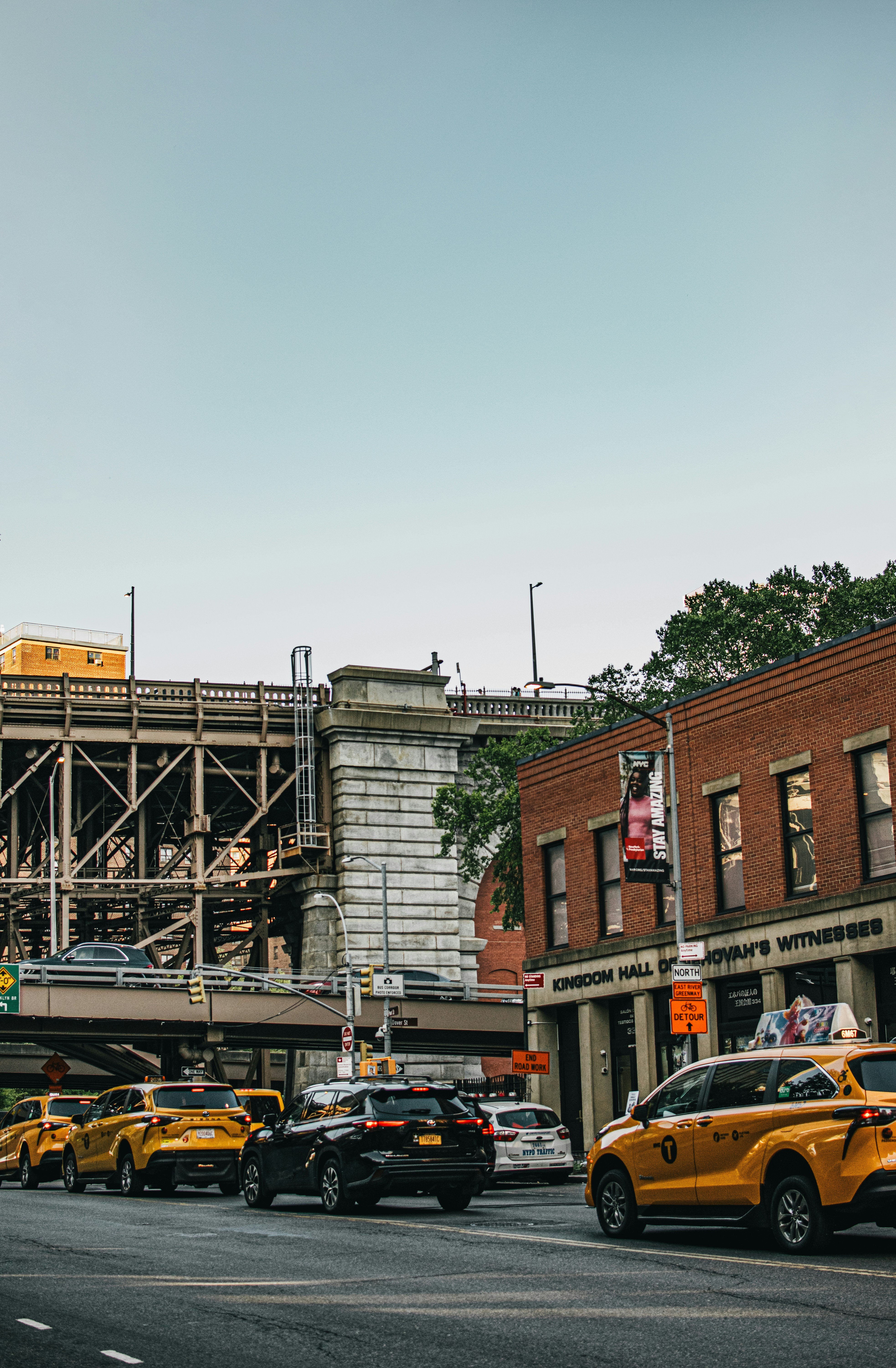City Crossing: Yellow Cabs, Brick Facades, and Rising Tracks