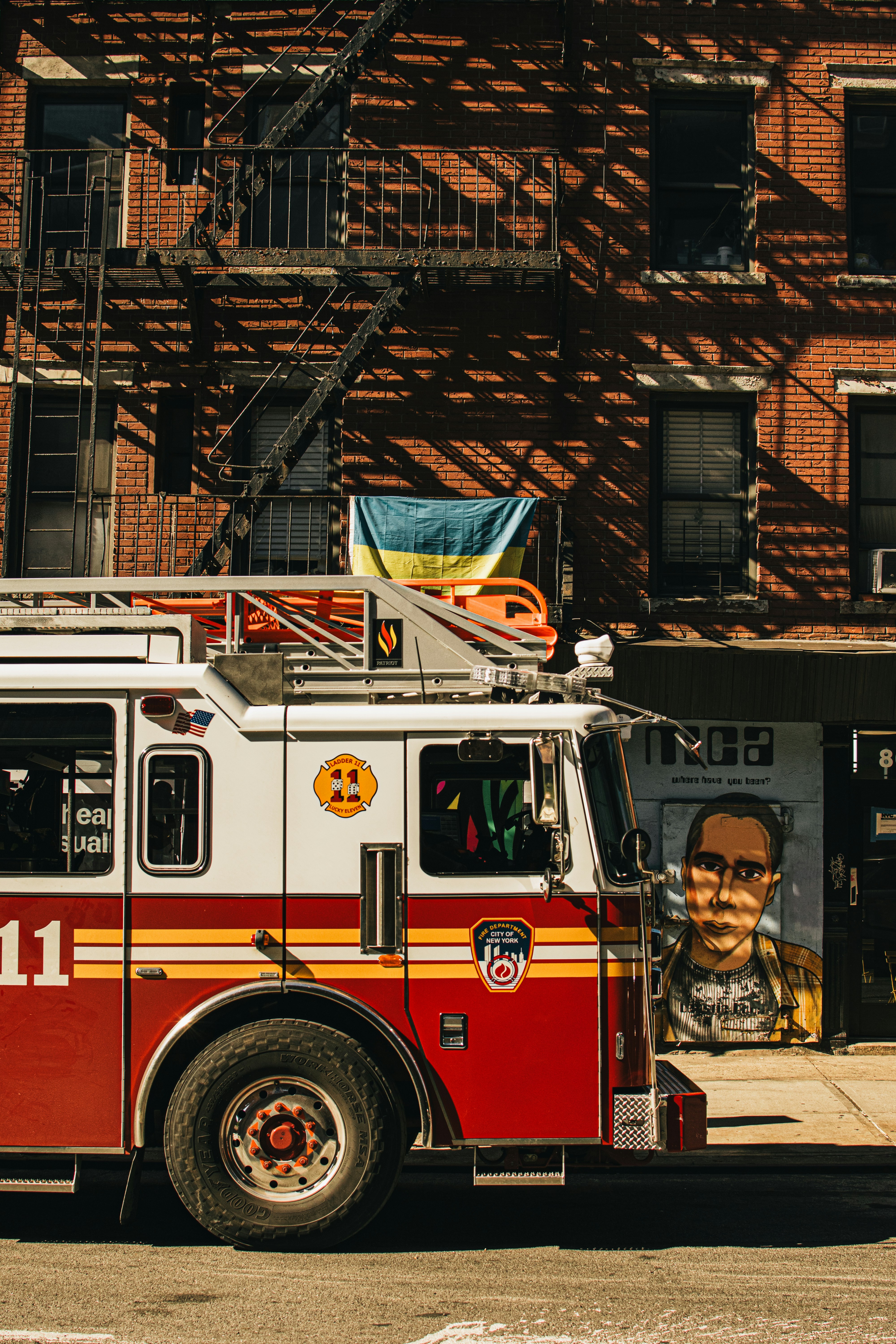 Fire Truck on a Deserted City Street with Wall Art