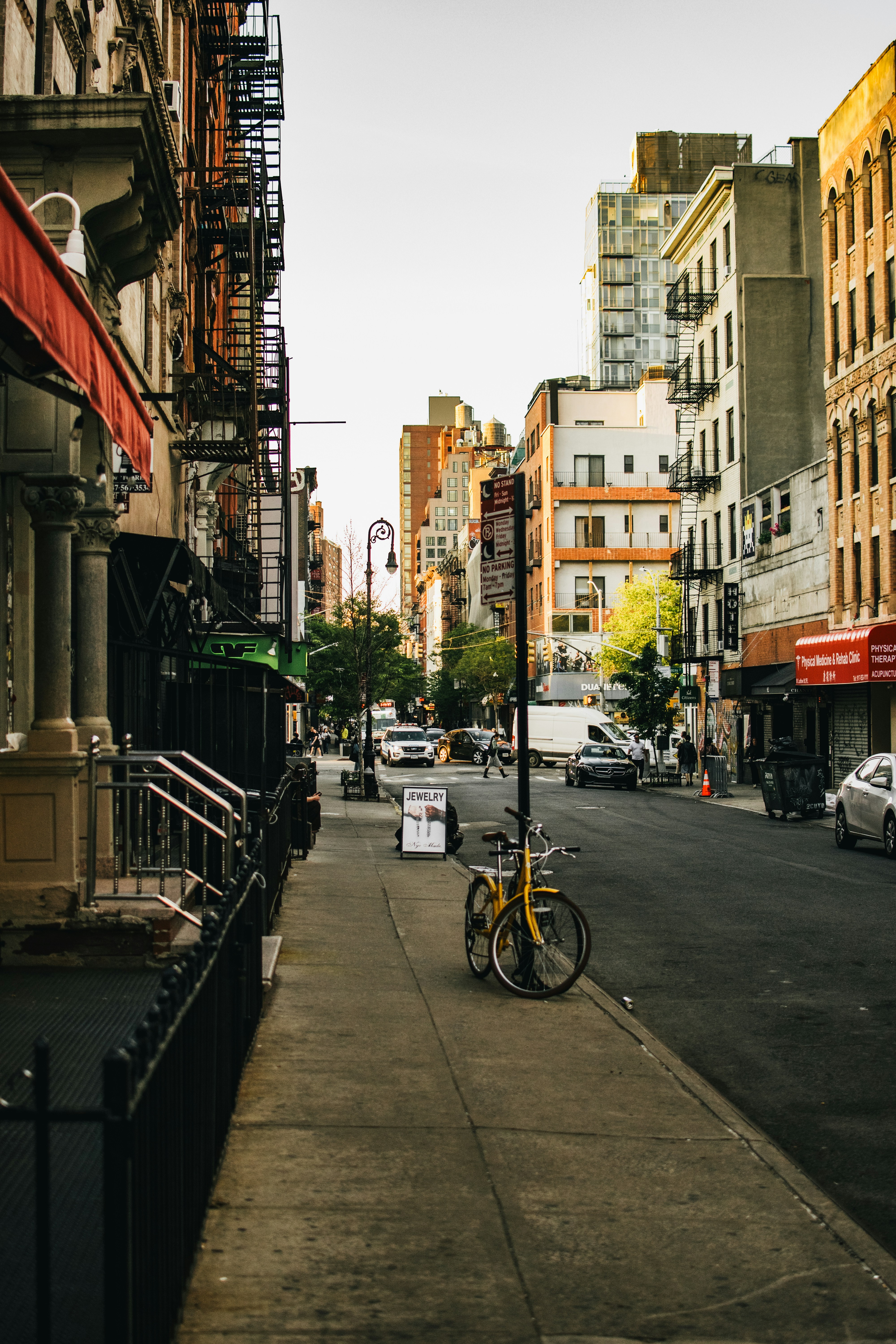 Urban Streetcorner still life with a lonely yellow bicycle