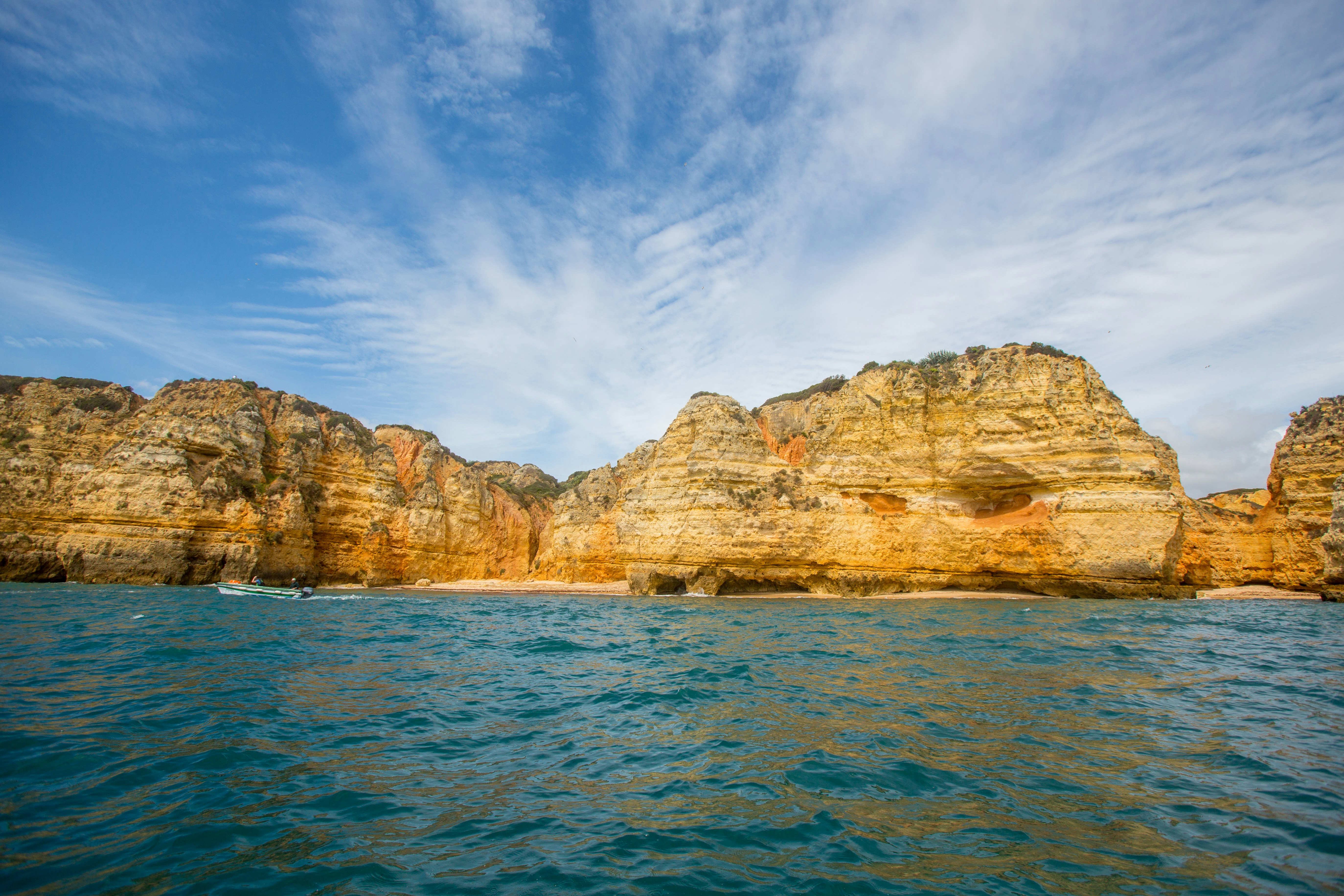 Cliffside Horizon Over Calm Blue Waters