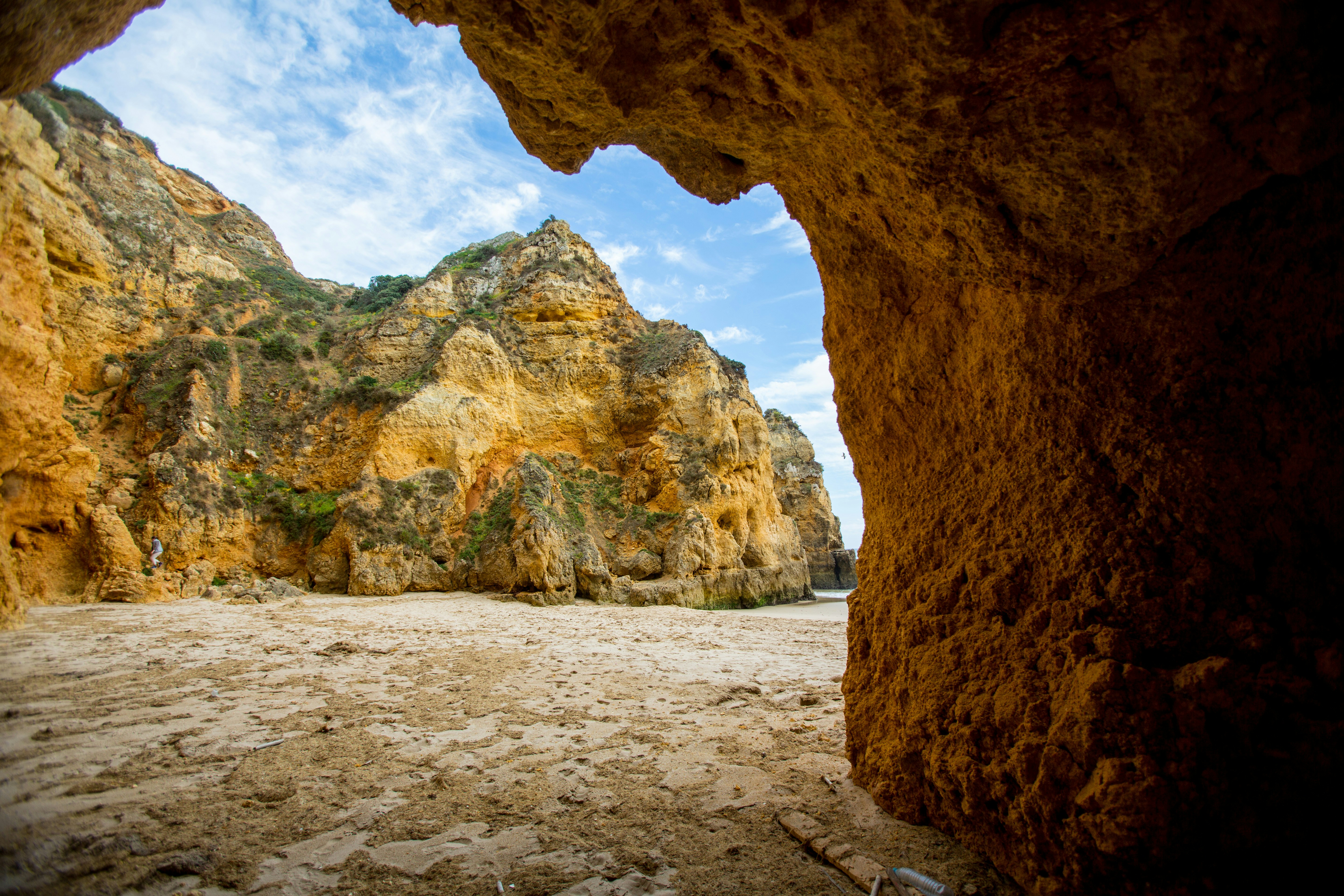 Cove of Golden Stone: Light Framing the Cliff Gate