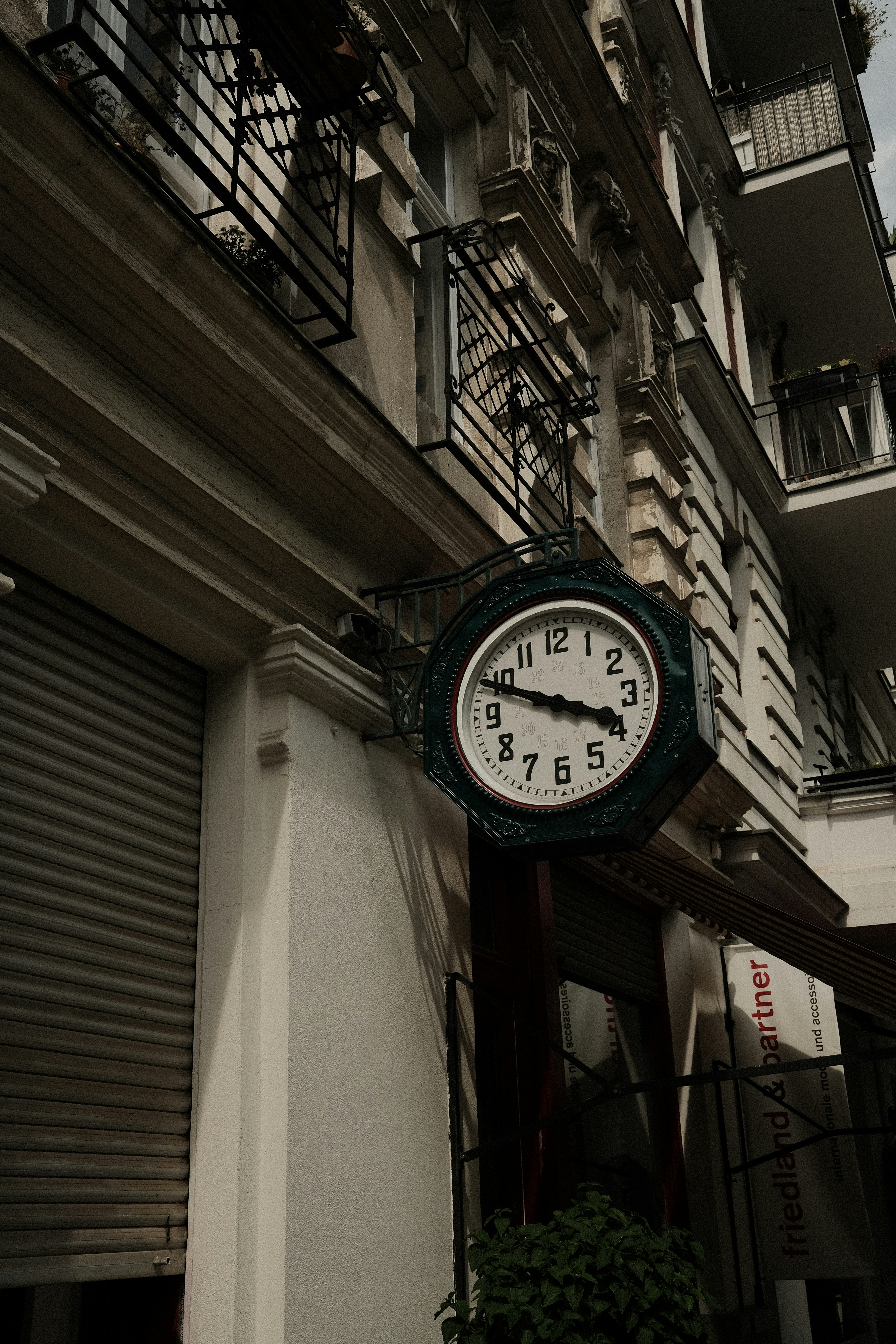 Clock on a Narrow Street: Time Woven into Urban Facades