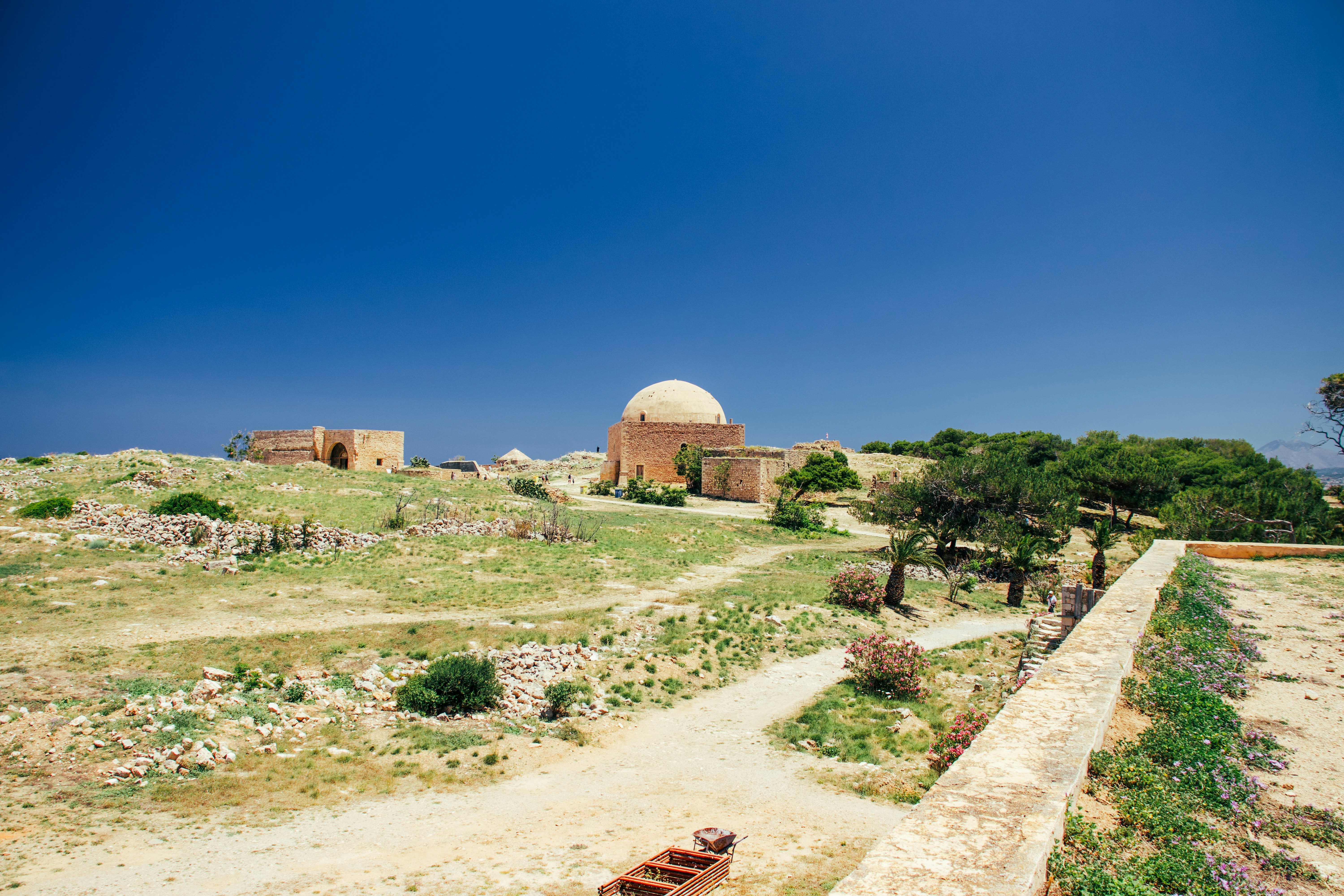Deserted hilltop fortress under a cobalt sky