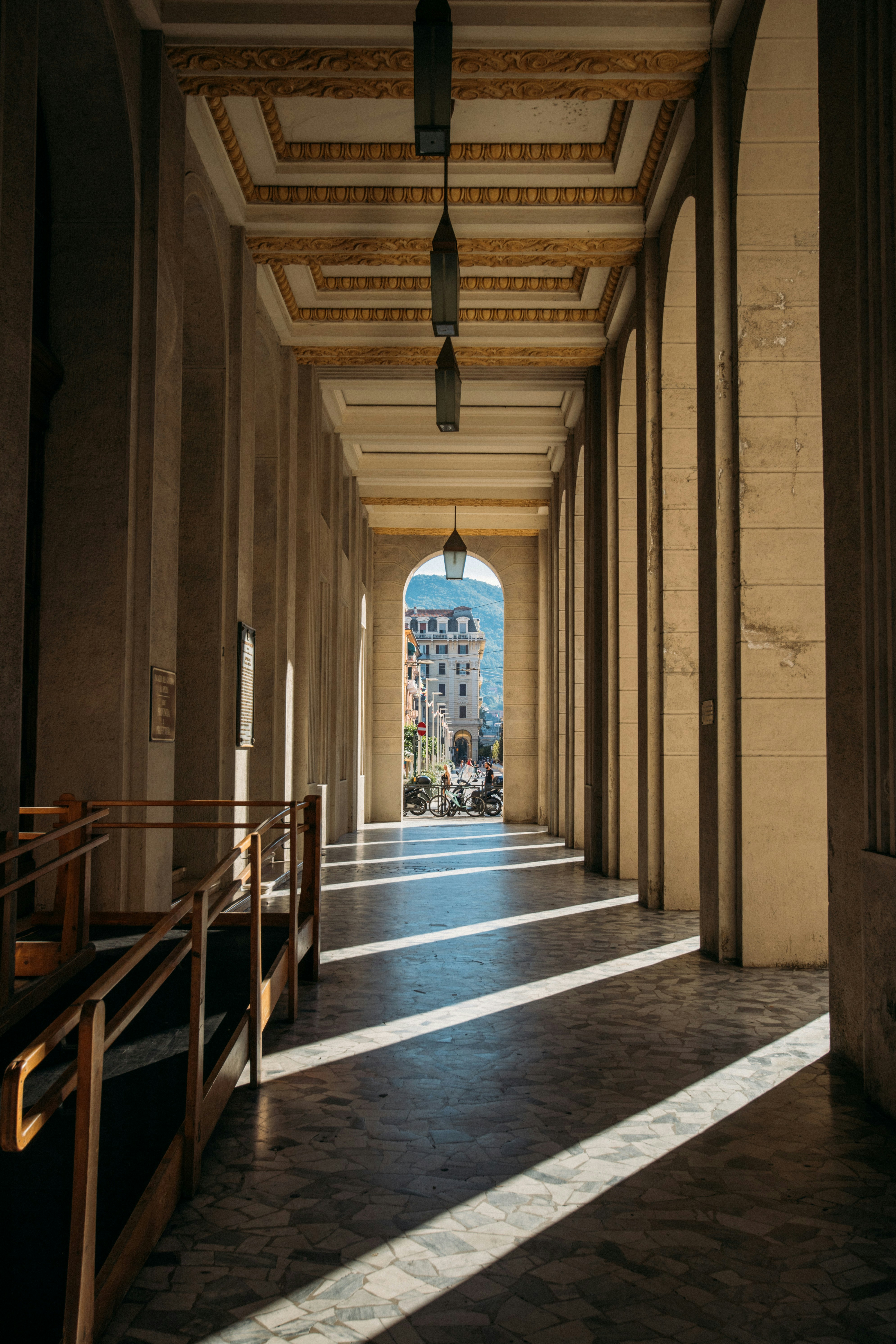 Light-filled Archway: A Corridor Framing a Quiet Street Beyond