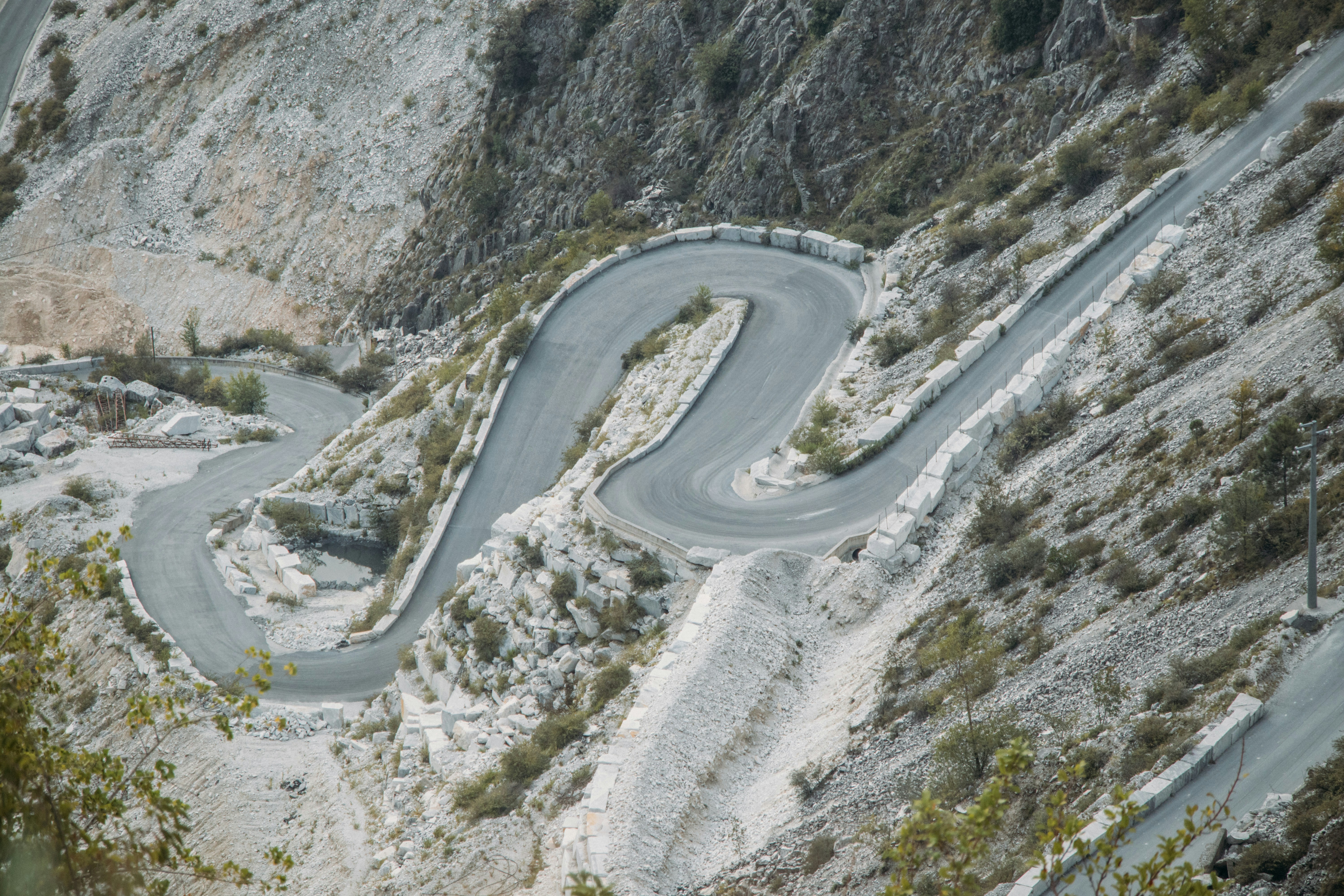 Serpentine Pass: A Narrow Mountain Road Winding Through Slate Terrains