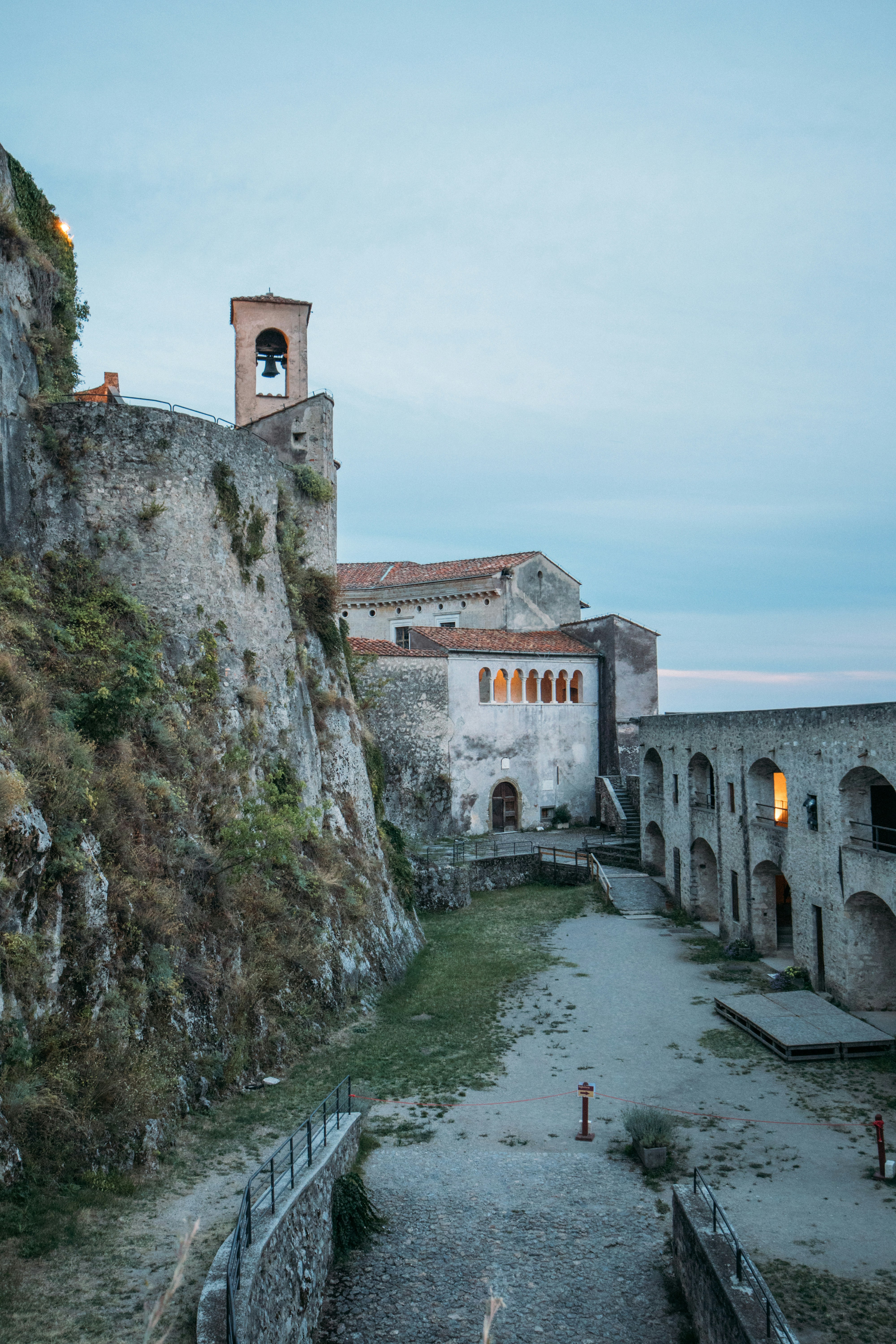 Ruined fortress stairwell basking in twilight