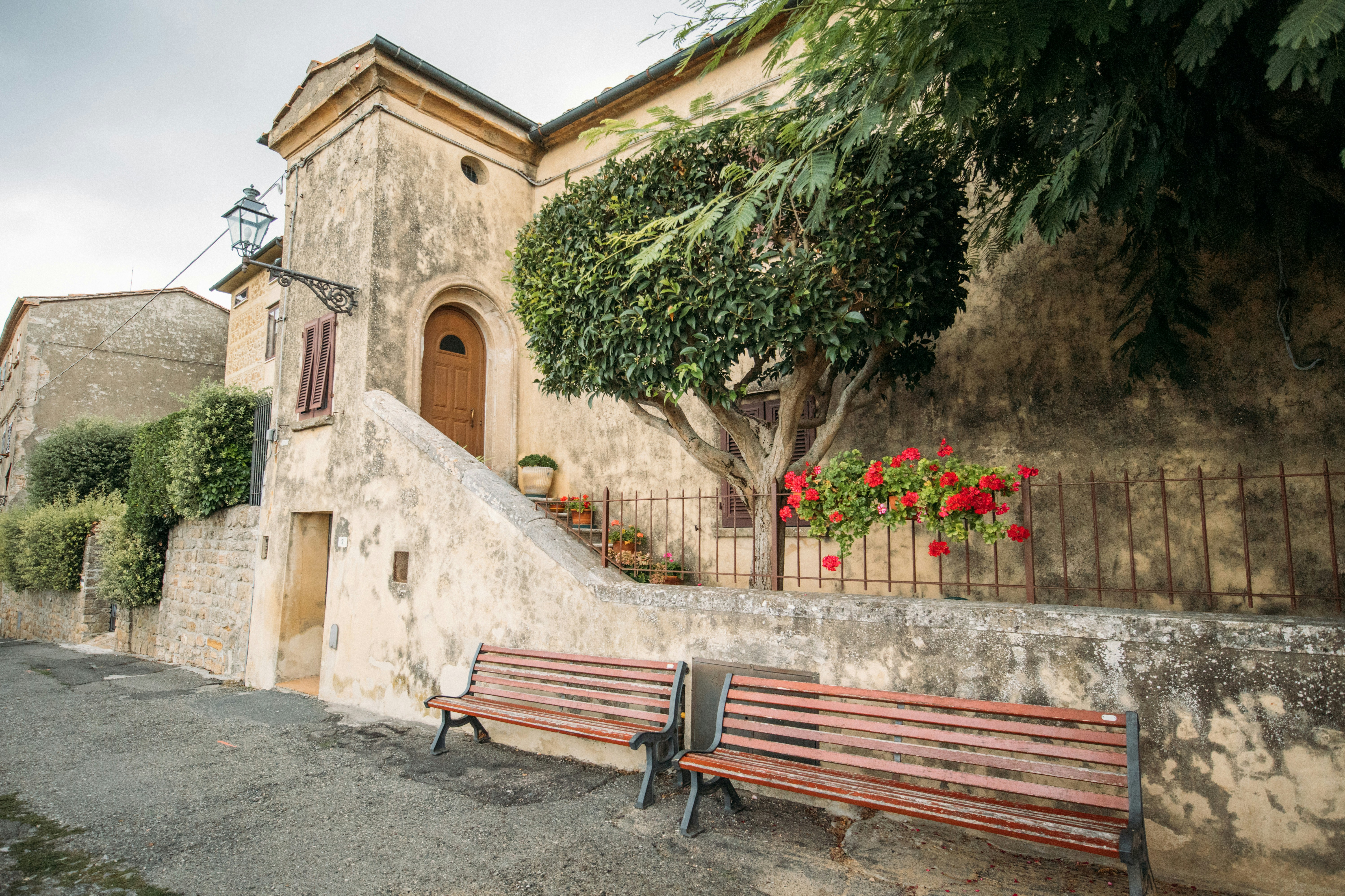Sunlit Terrace and Ancient Wall: A Quiet Village Scene
