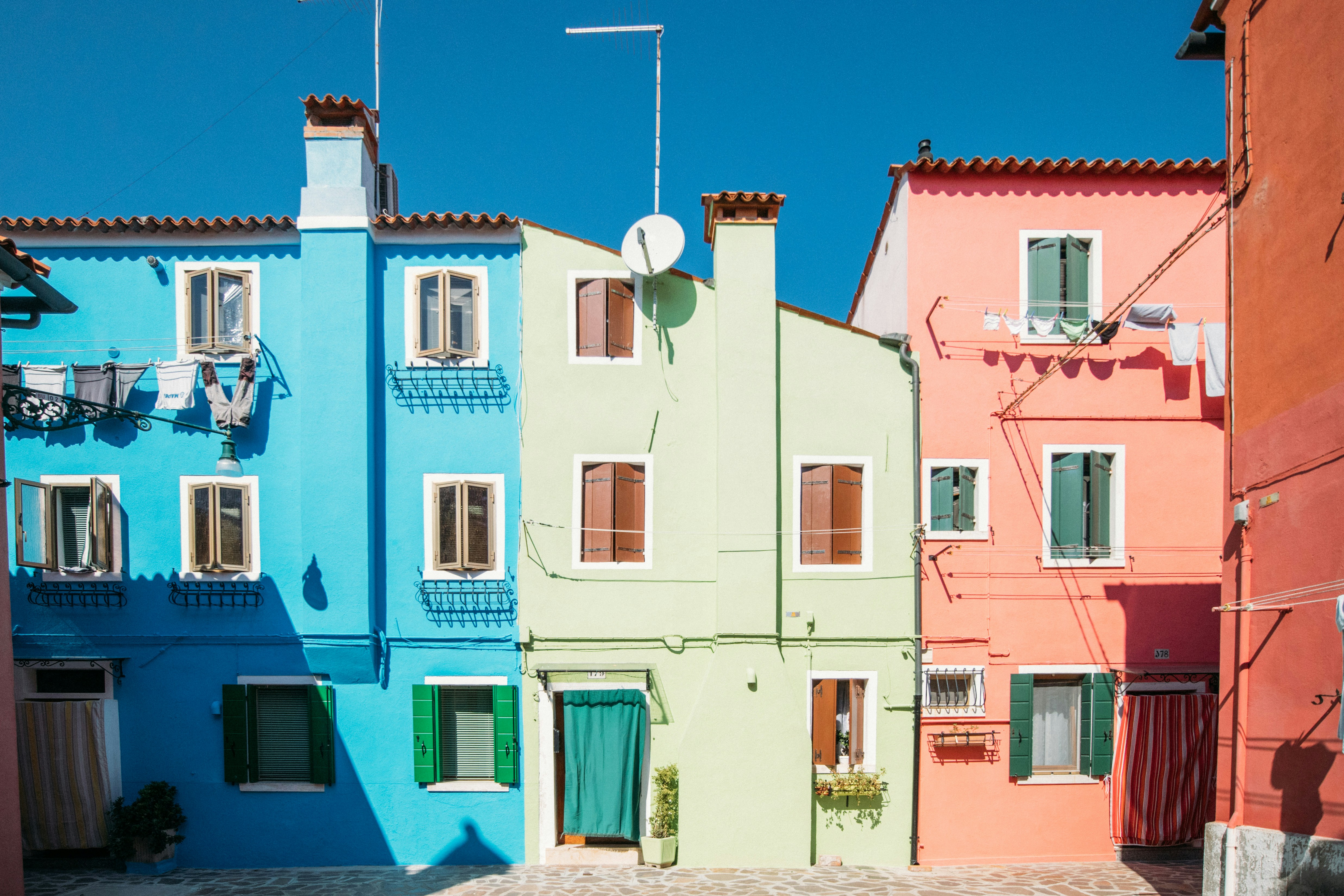 Colorful Row Houses Align Under a Bright Mediterranean Sky