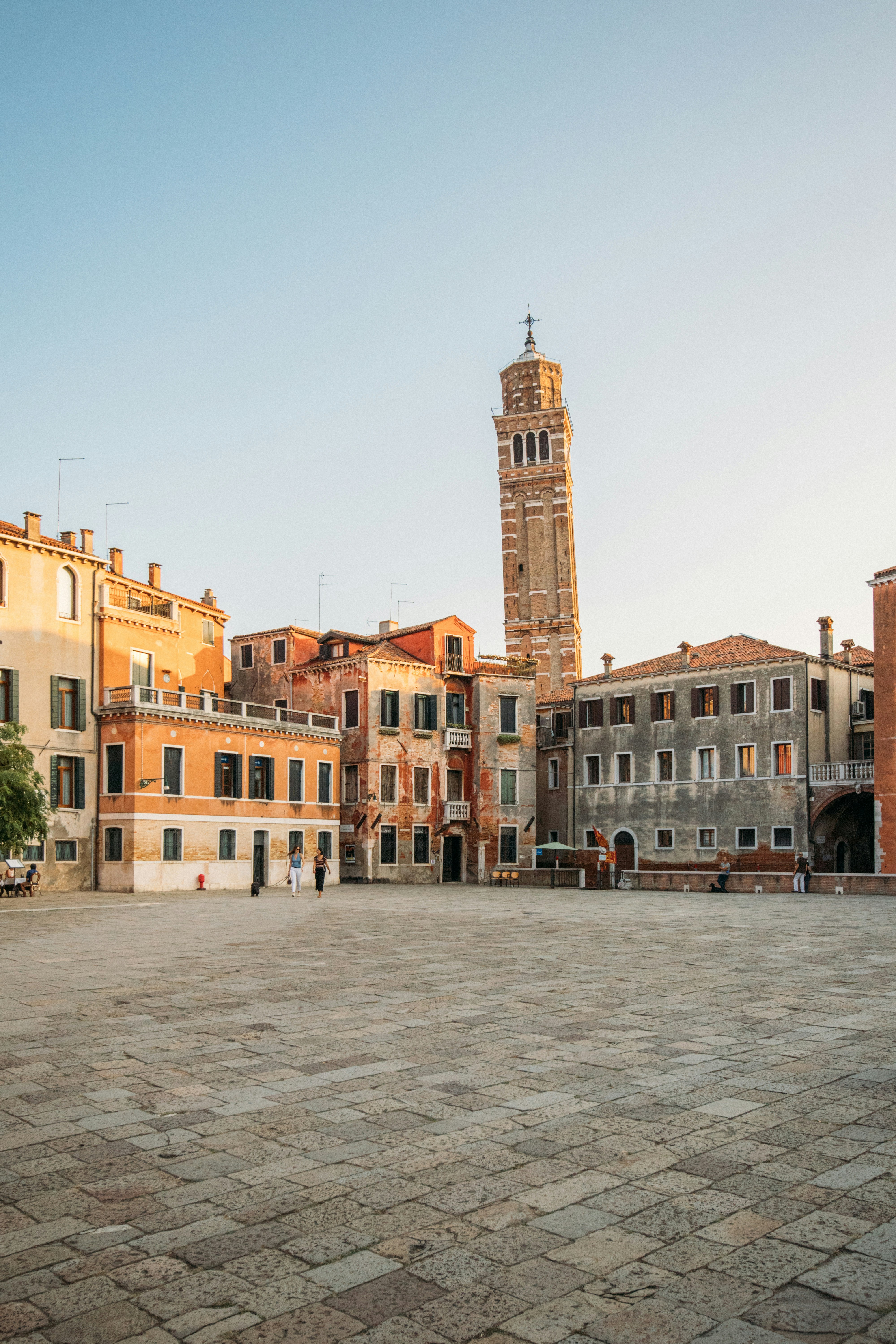 Towering Clocktower over a Sunlit Venetian-Style Square