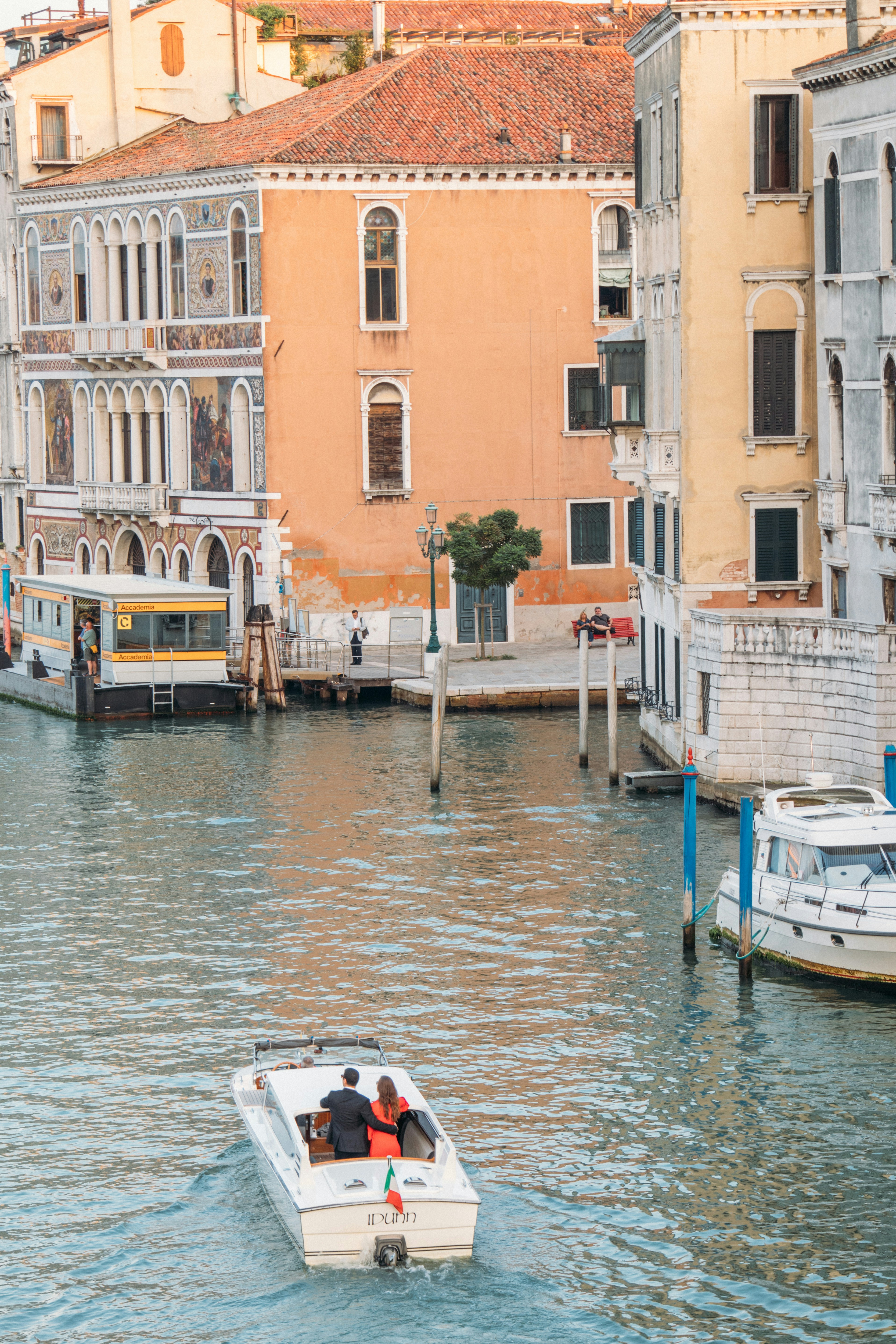 Voyage Through Venice: A Small Motorboat at the Docks