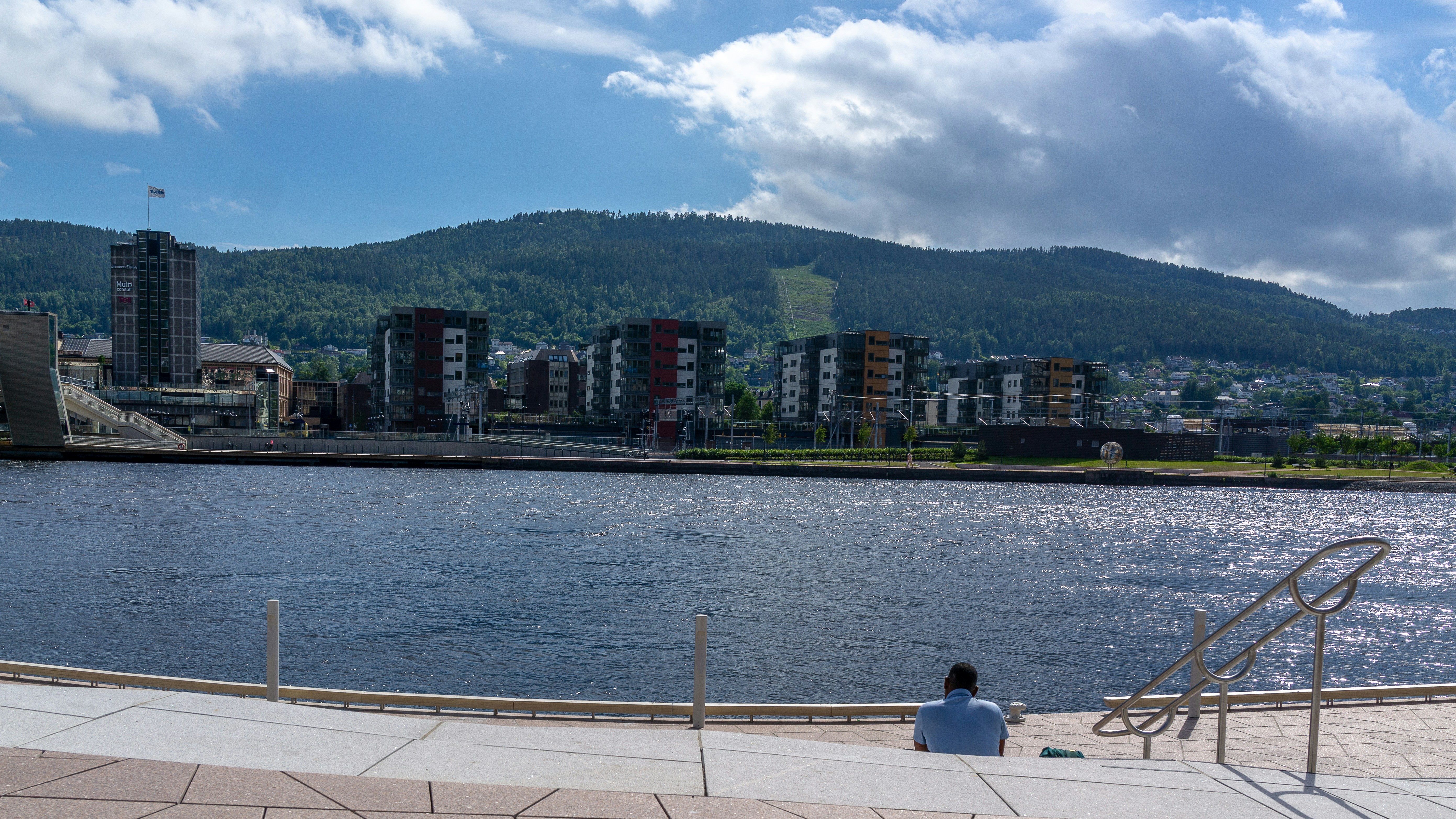 Riverside Cityscape: A Quiet Moment by the Water
