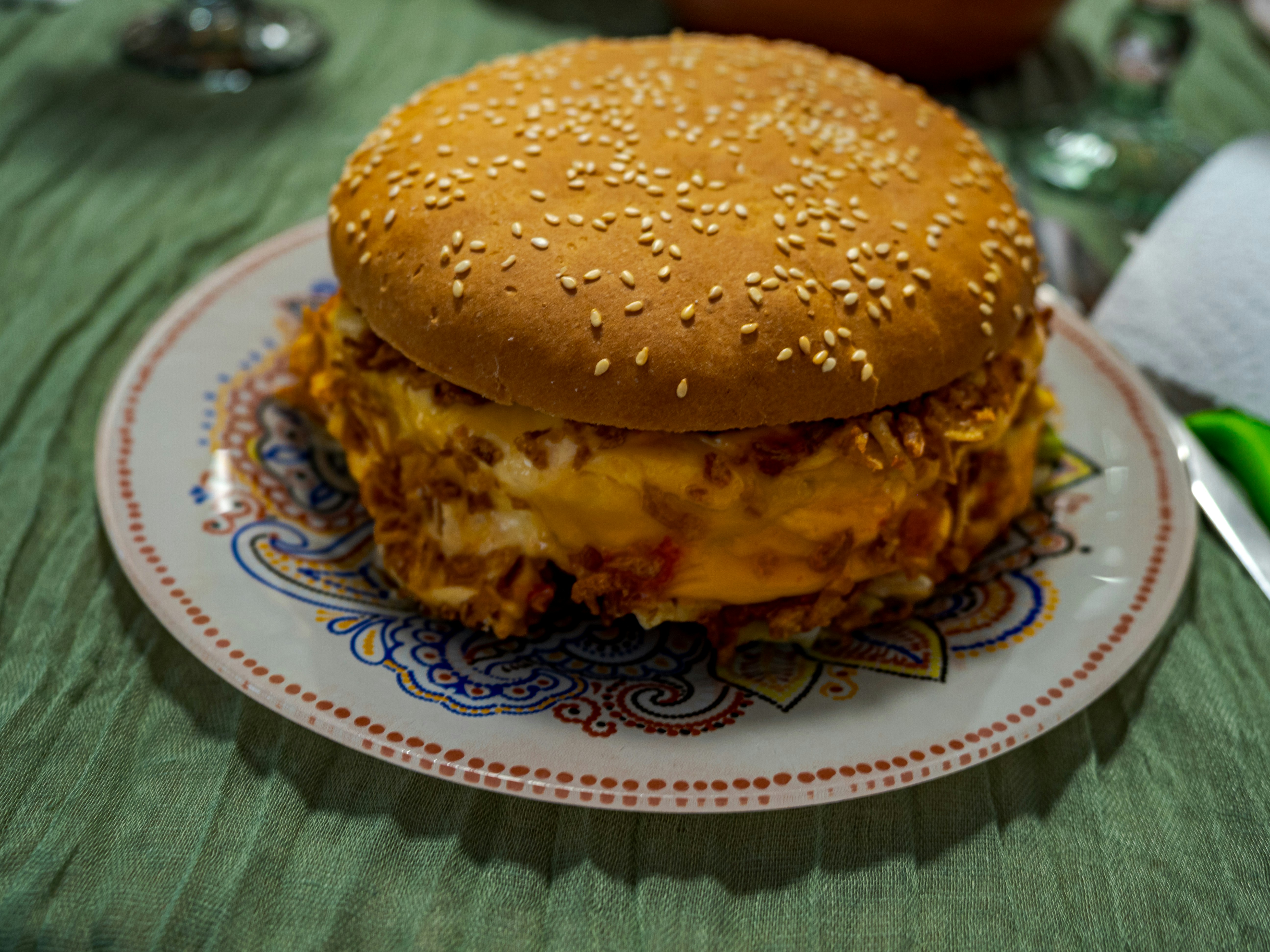 Sesame Bun Spotlight: Cheesy Stack on a Painted Plate