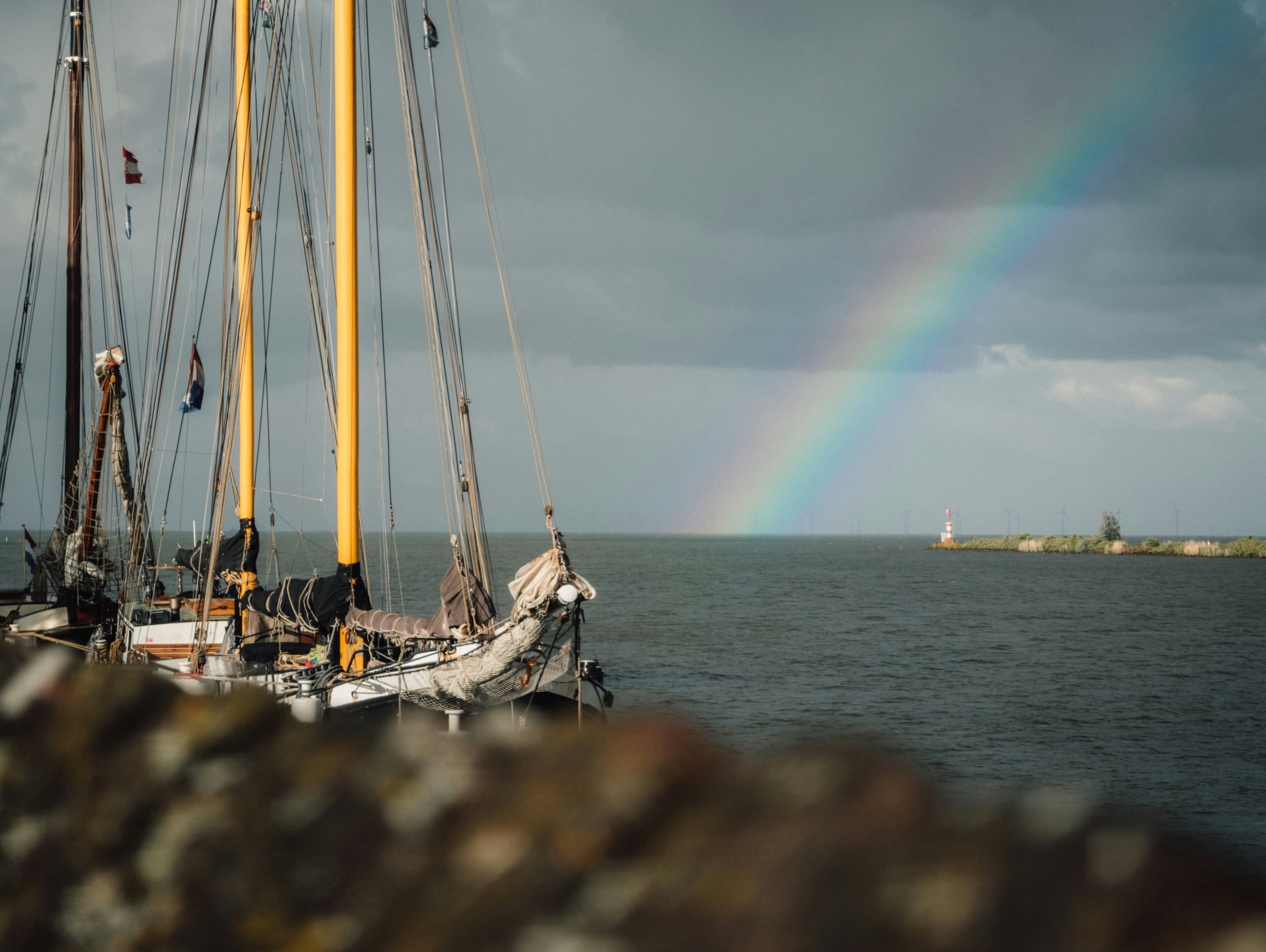 Rainbow Over the Quayside: Sailboats and Sea