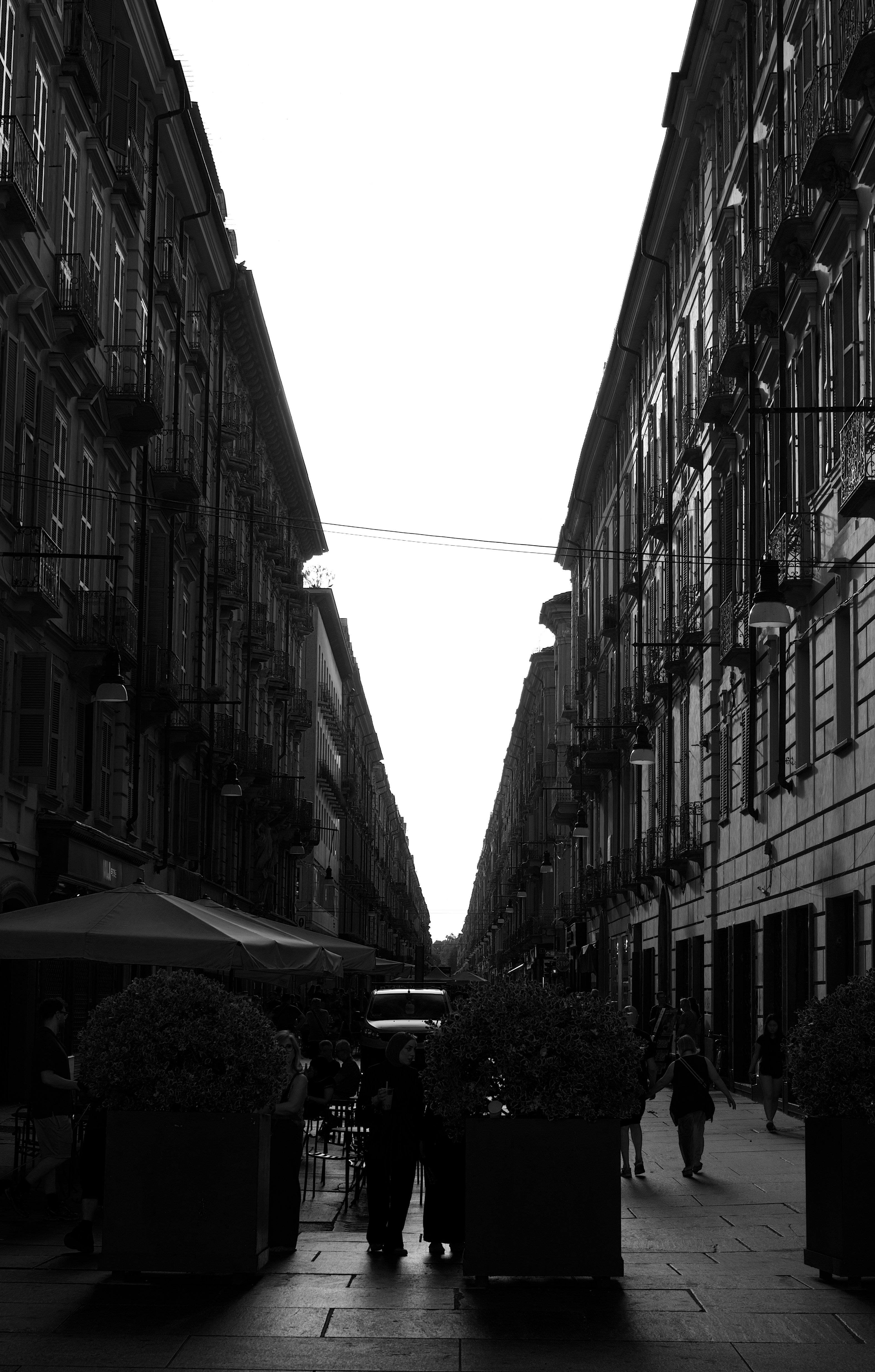 Cobbled Street Convergence: A Narrow Galleria Framing the City