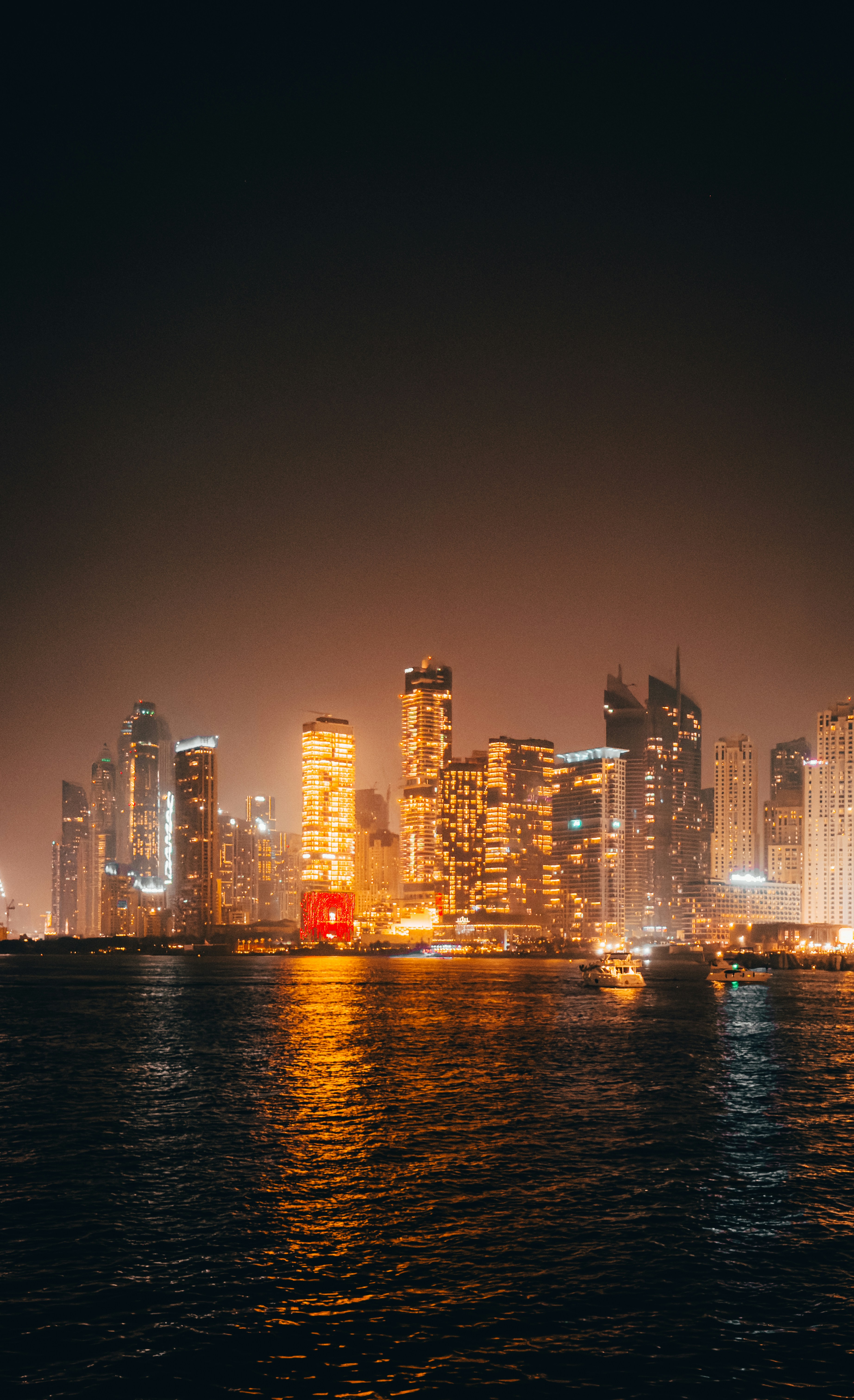 City Lights Touch the Horizon Across Calm Waters