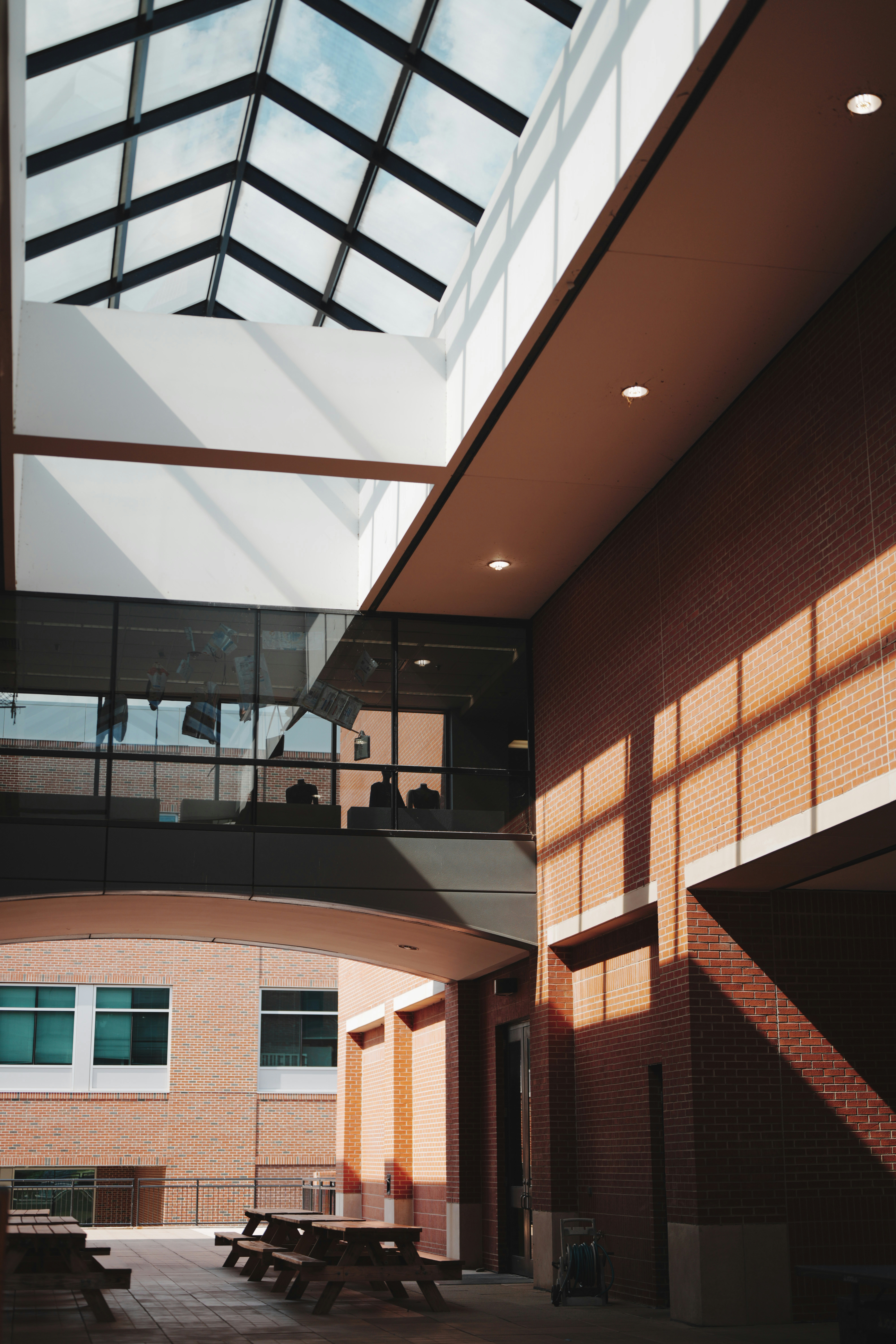 Sunlit Atrium Sketches: Bricks, Glass, and Shadows