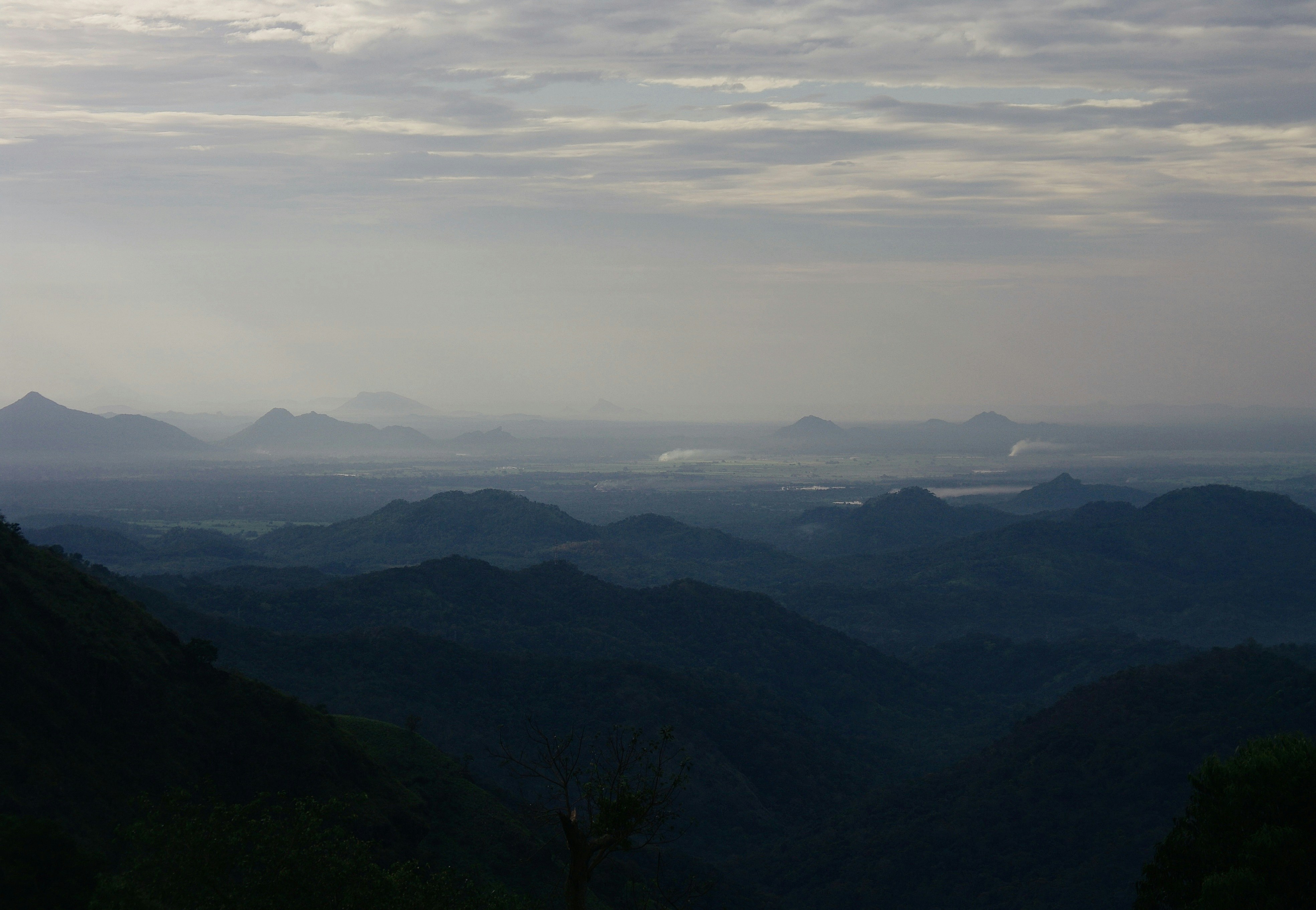 Horizon Veil Over Layered Mountains