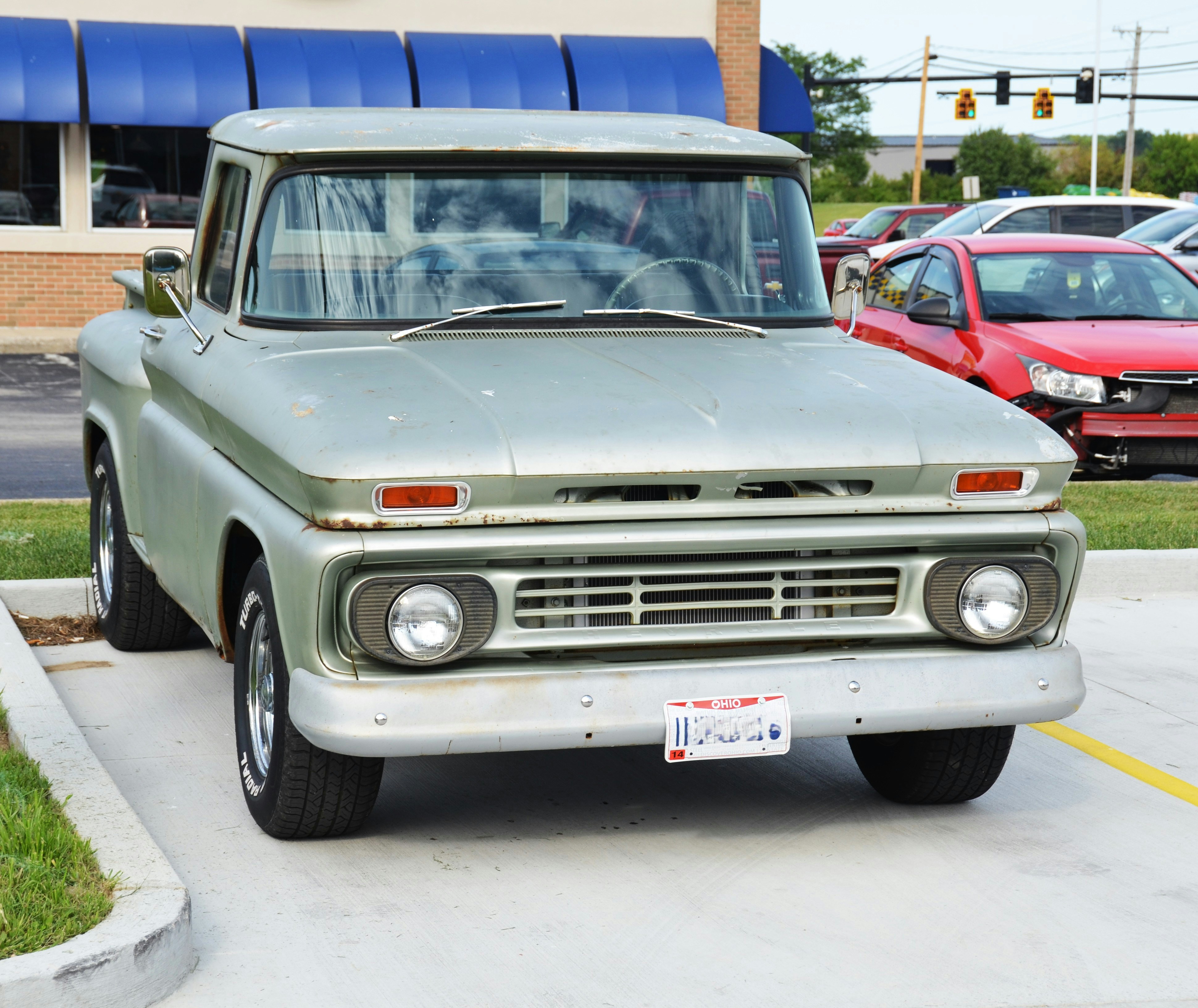 Vintage Pickup Stalling in Time: Classic Steel Meets Suburban Lane