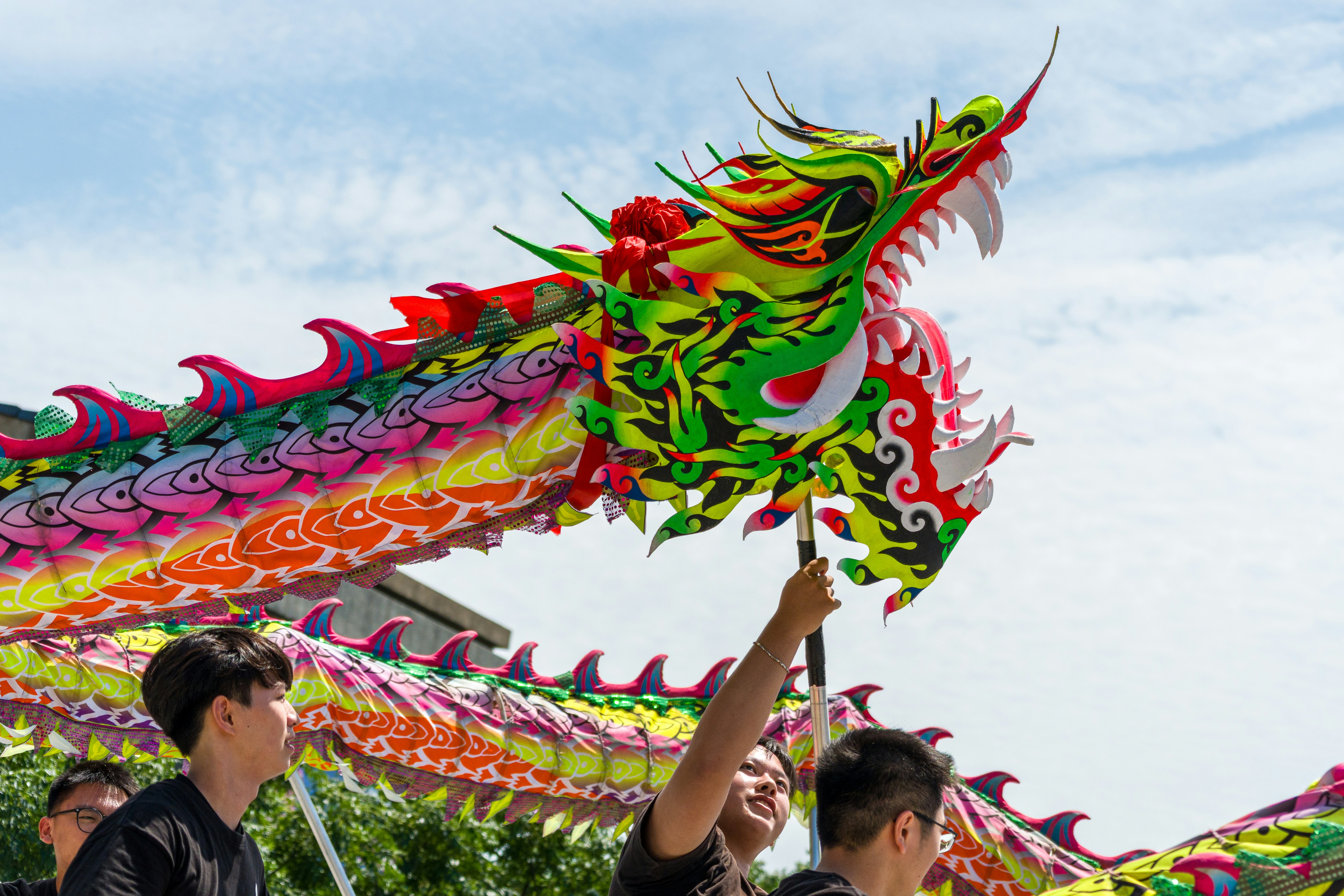Gesture of a Dragon: A Crowd Beneath a Fiery Spectacle