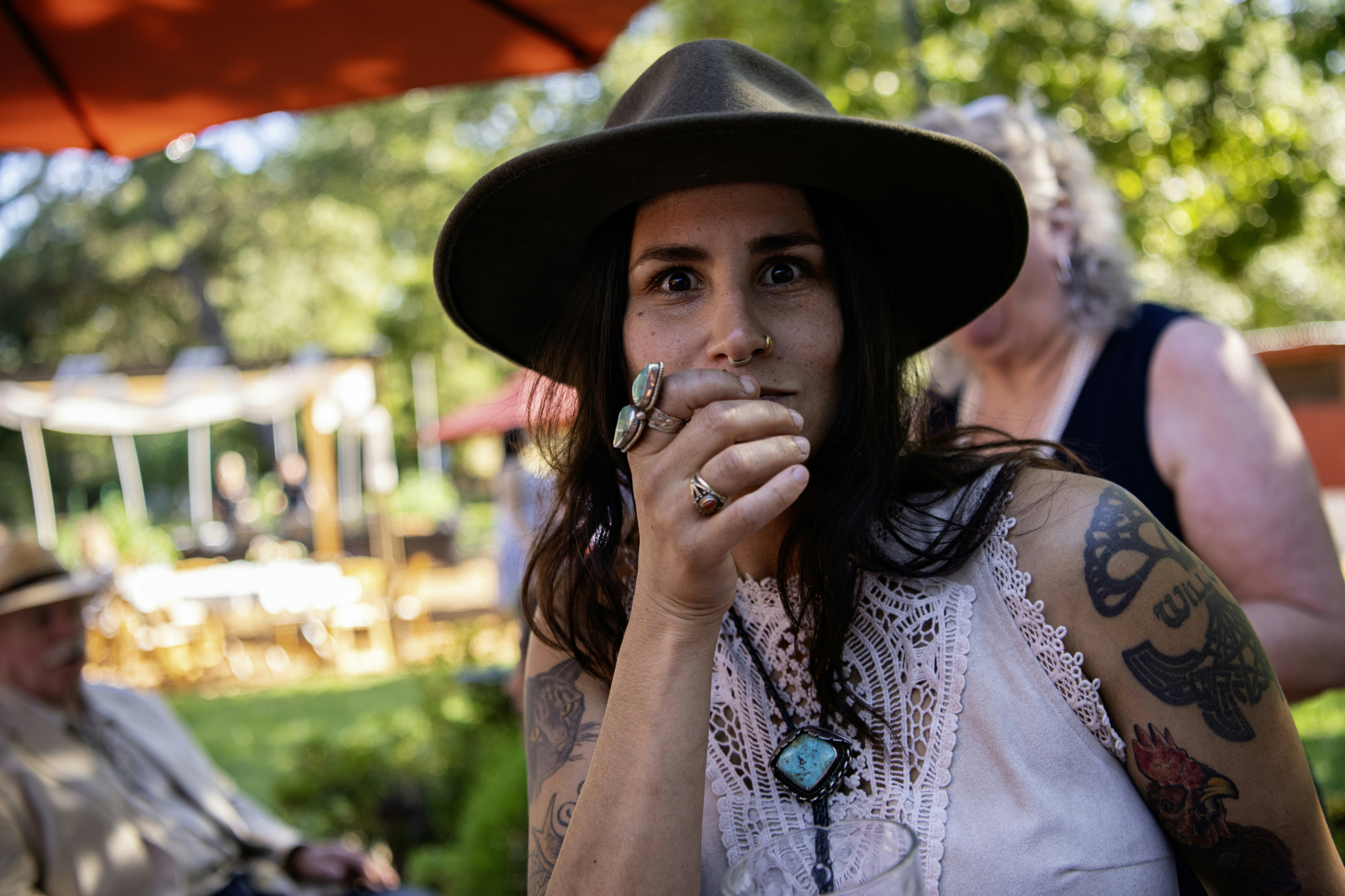 Wistful Gaze at a Sunny Gathering
