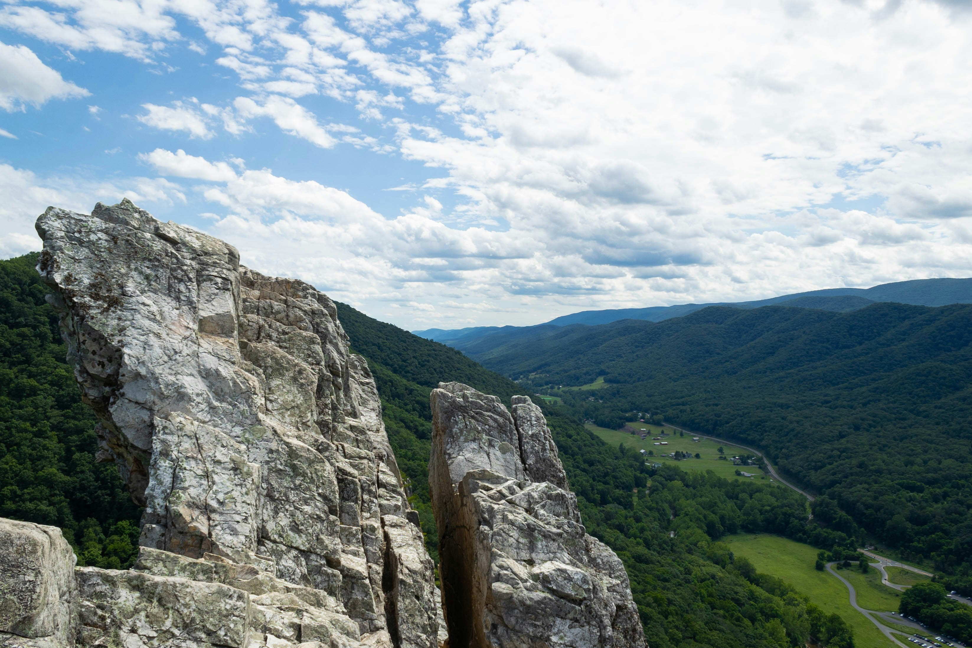 Cliff Edge Overlooking the Valley: Rugged Limestone and Green Vales