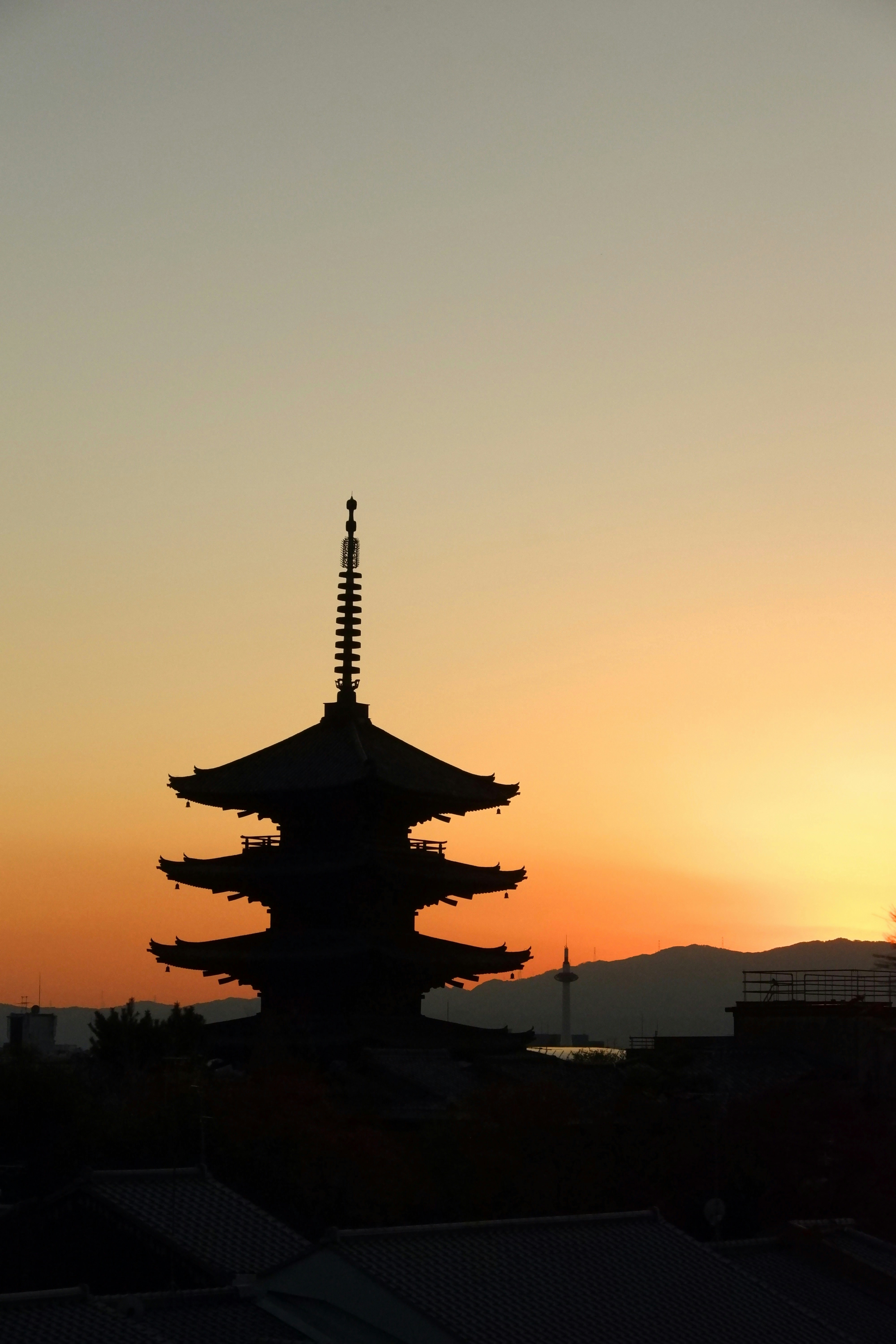 Silhouette at Dusk: The Five-Tier Pagoda Against a Golden Horizon