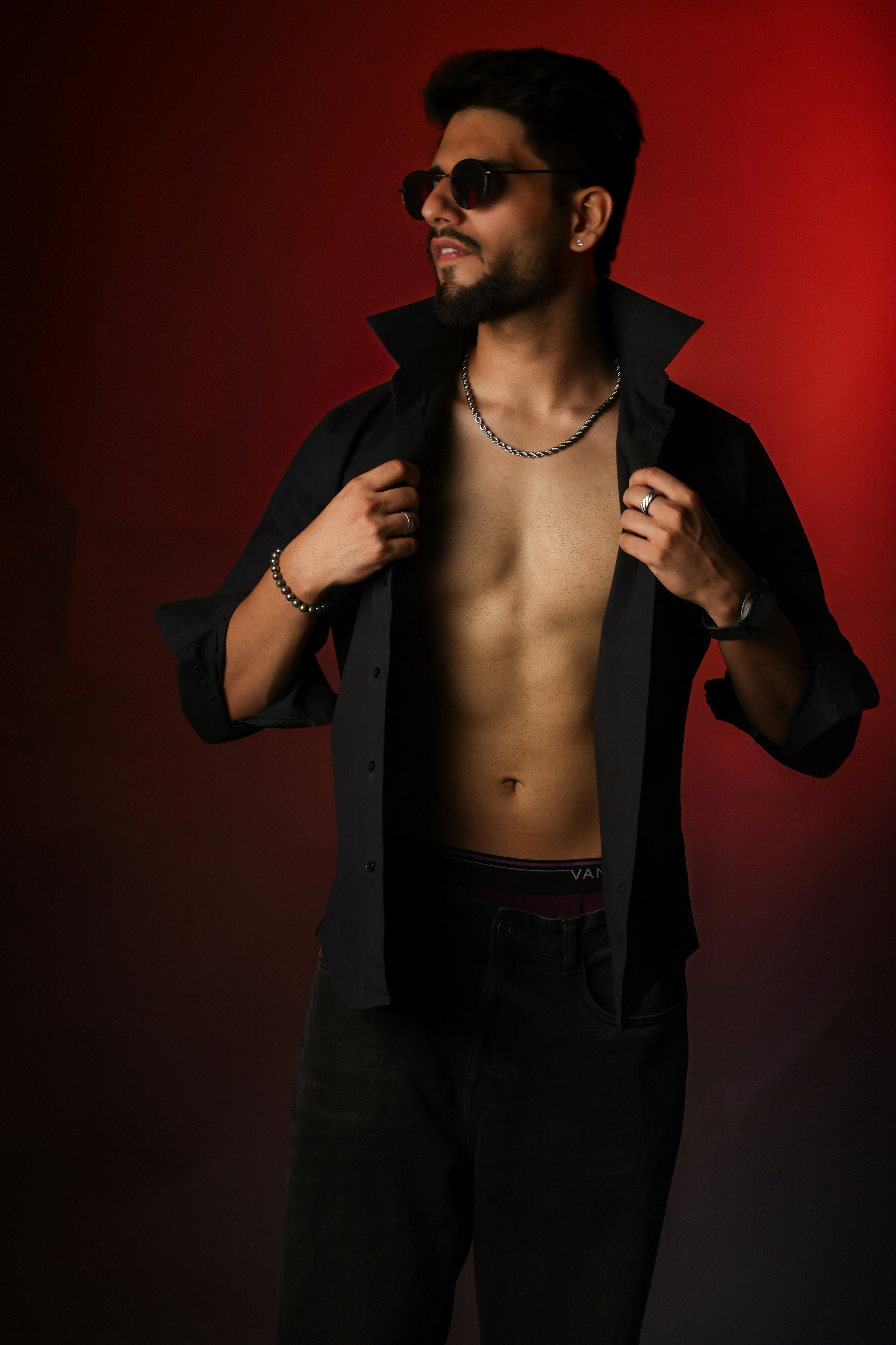 Midnight Confidence: A Stylish Silhouette in Red Halo