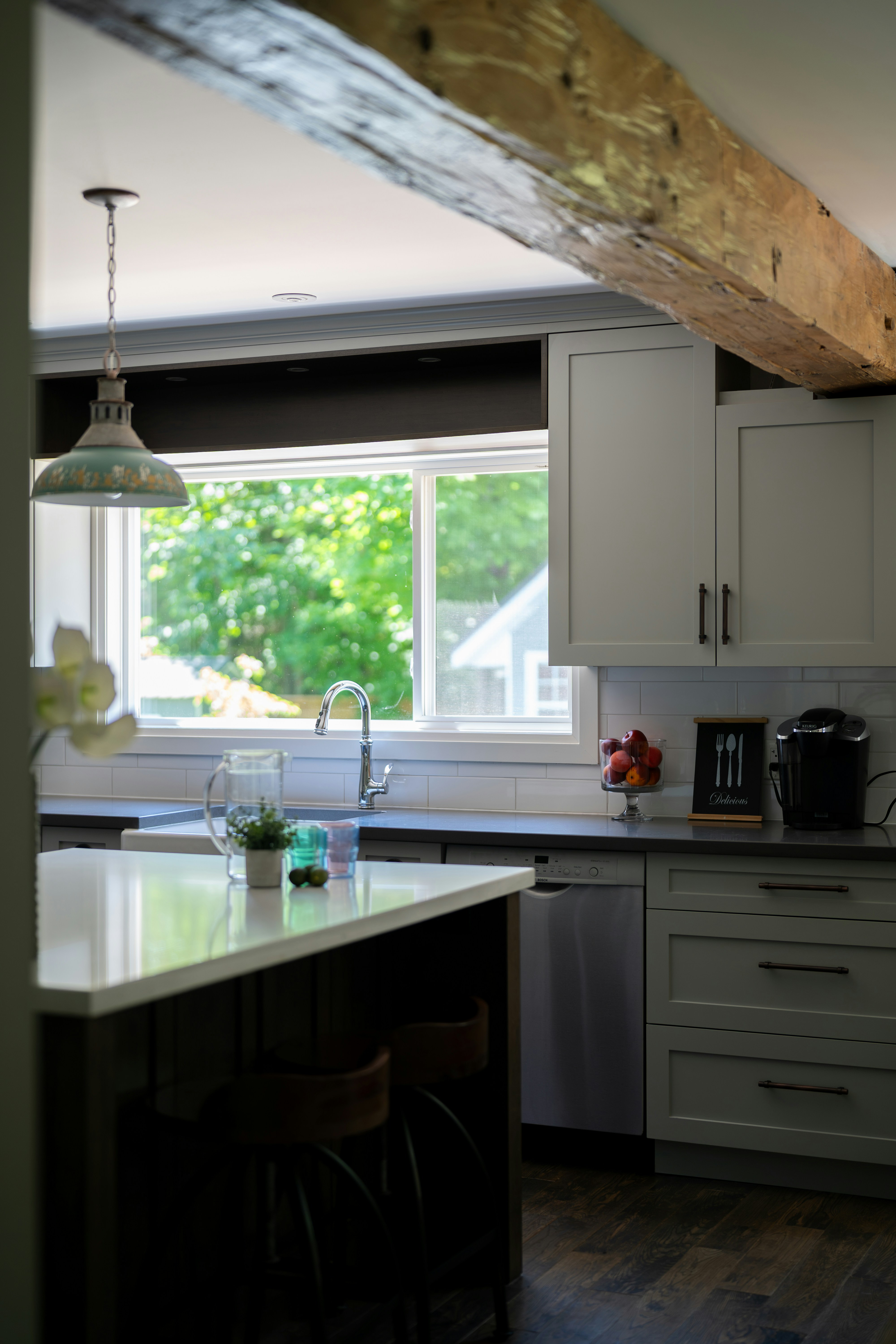 Morning Light in a Modern Kitchen Under a Reclaimed Wood Beam