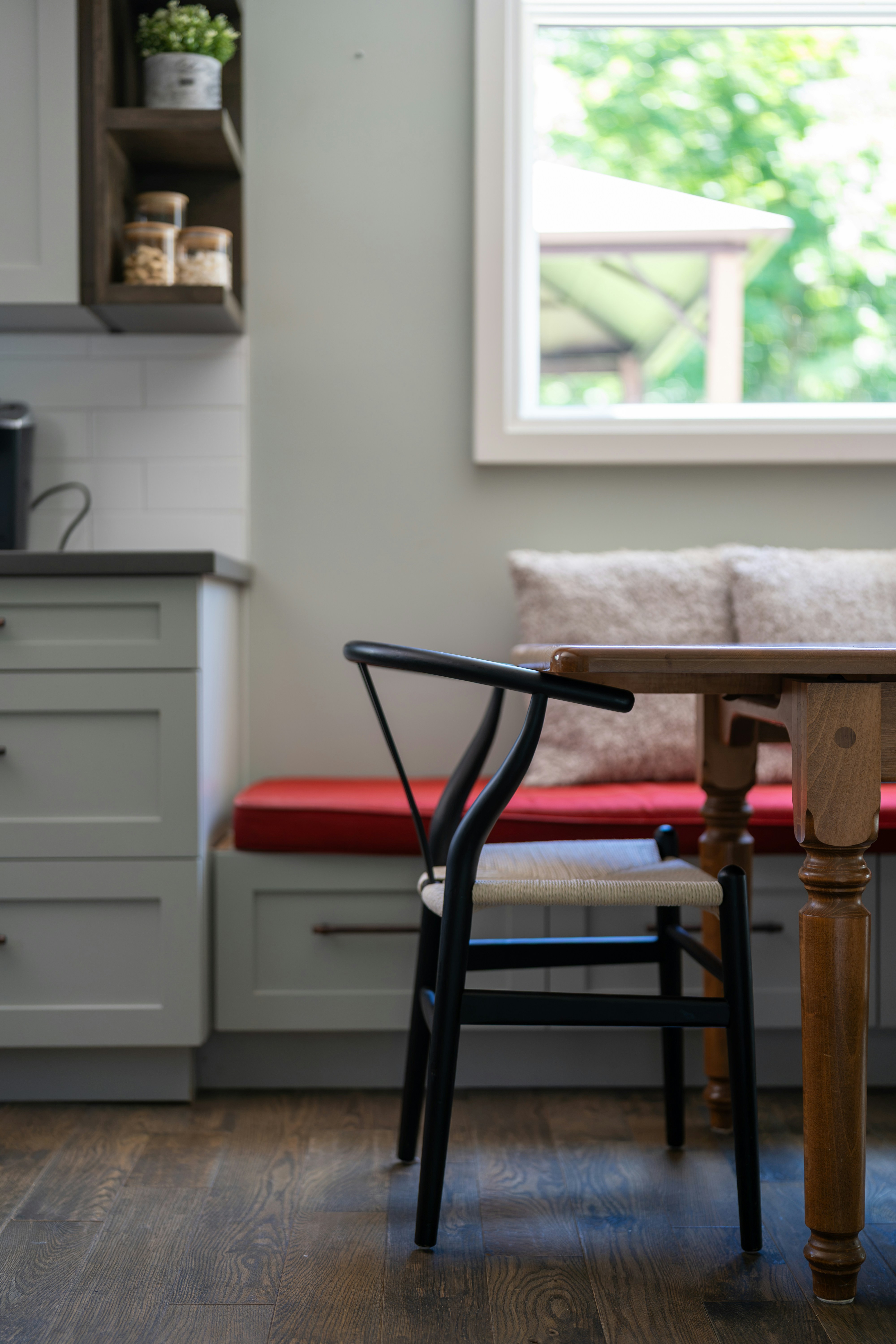 Quiet Kitchen Corner with a Rustic Table and Bench Seating