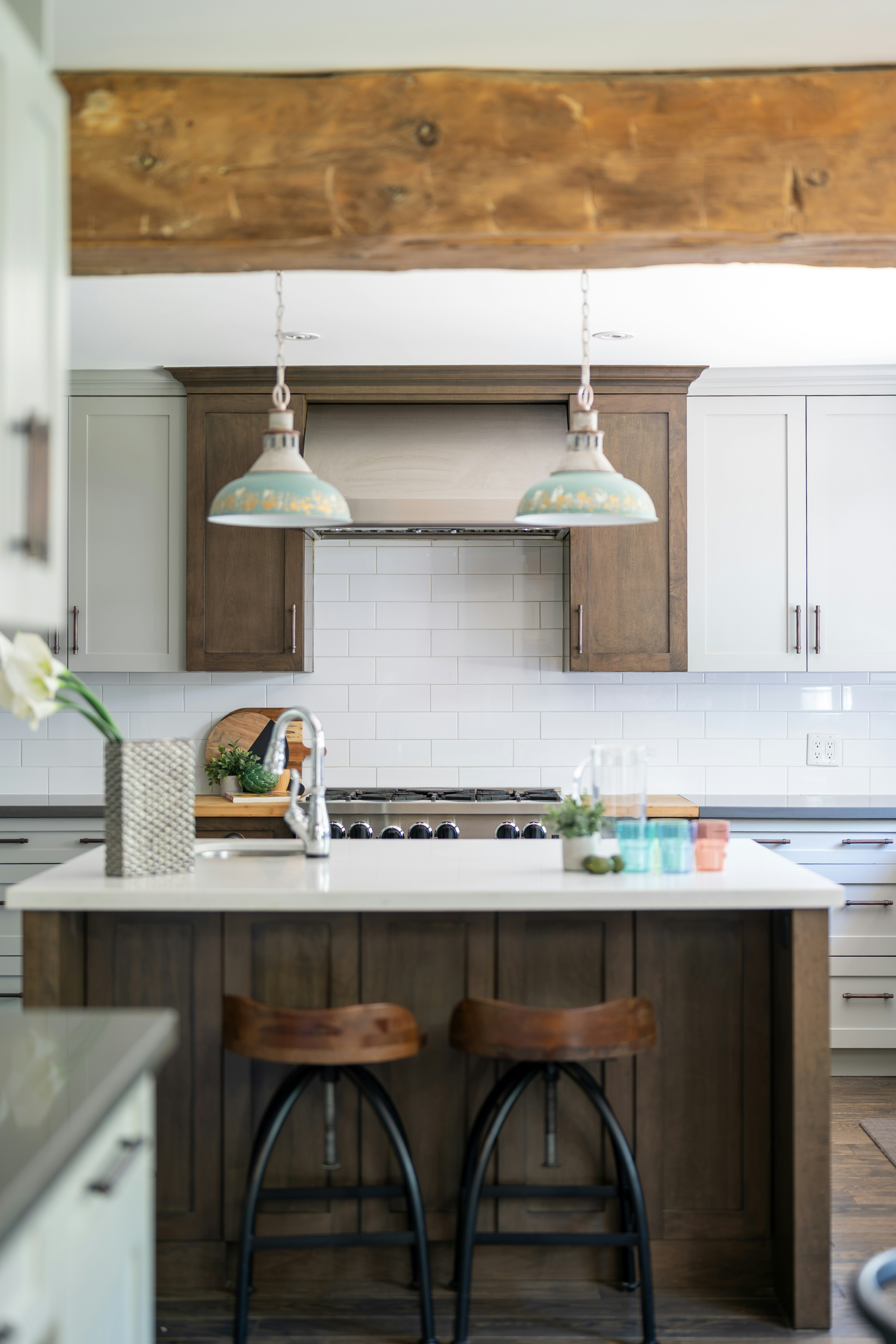 Warm Kitchen Island Under Rustic Beam