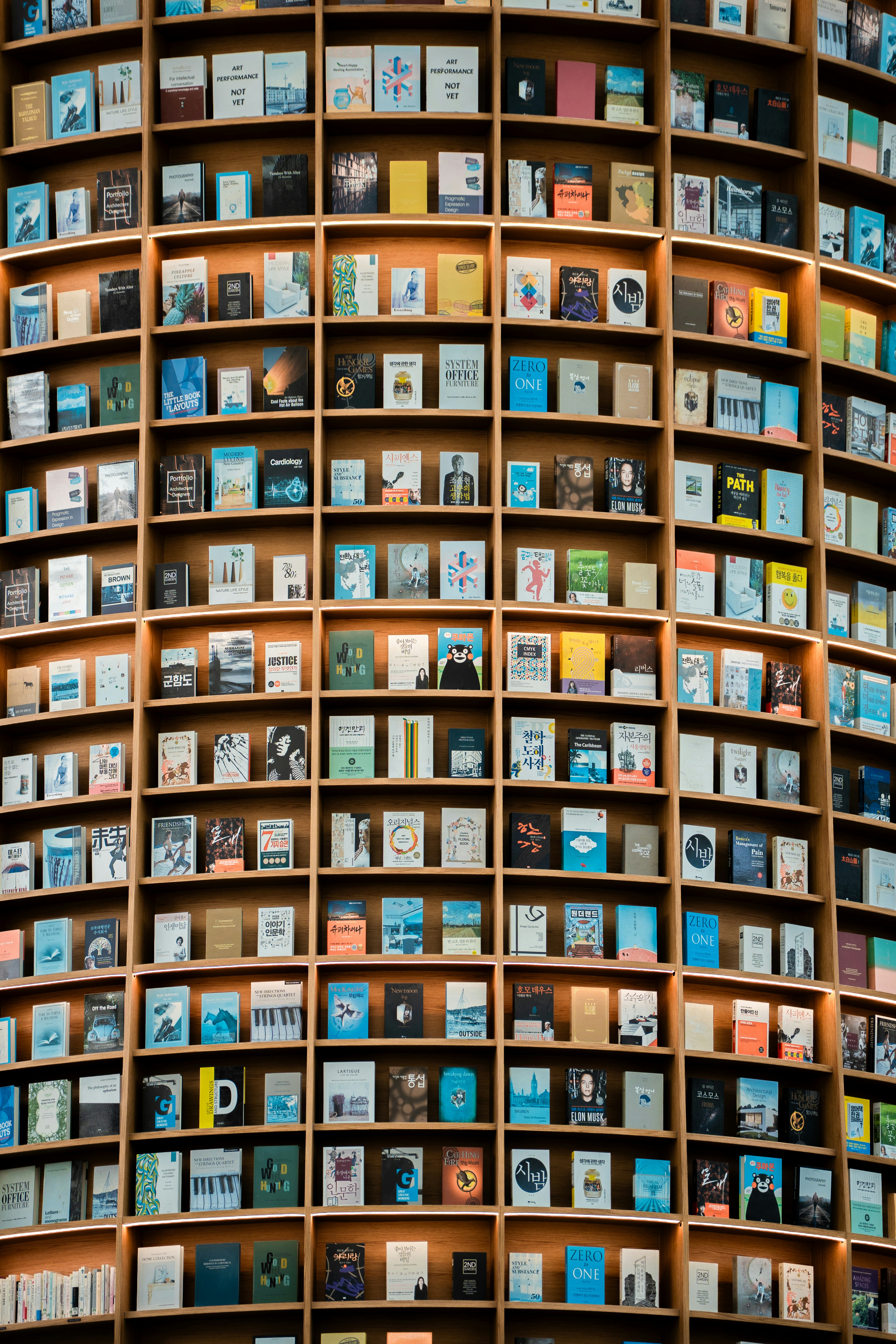 Curated Ocean of Pages: A Curved Library of Tiny Volumes