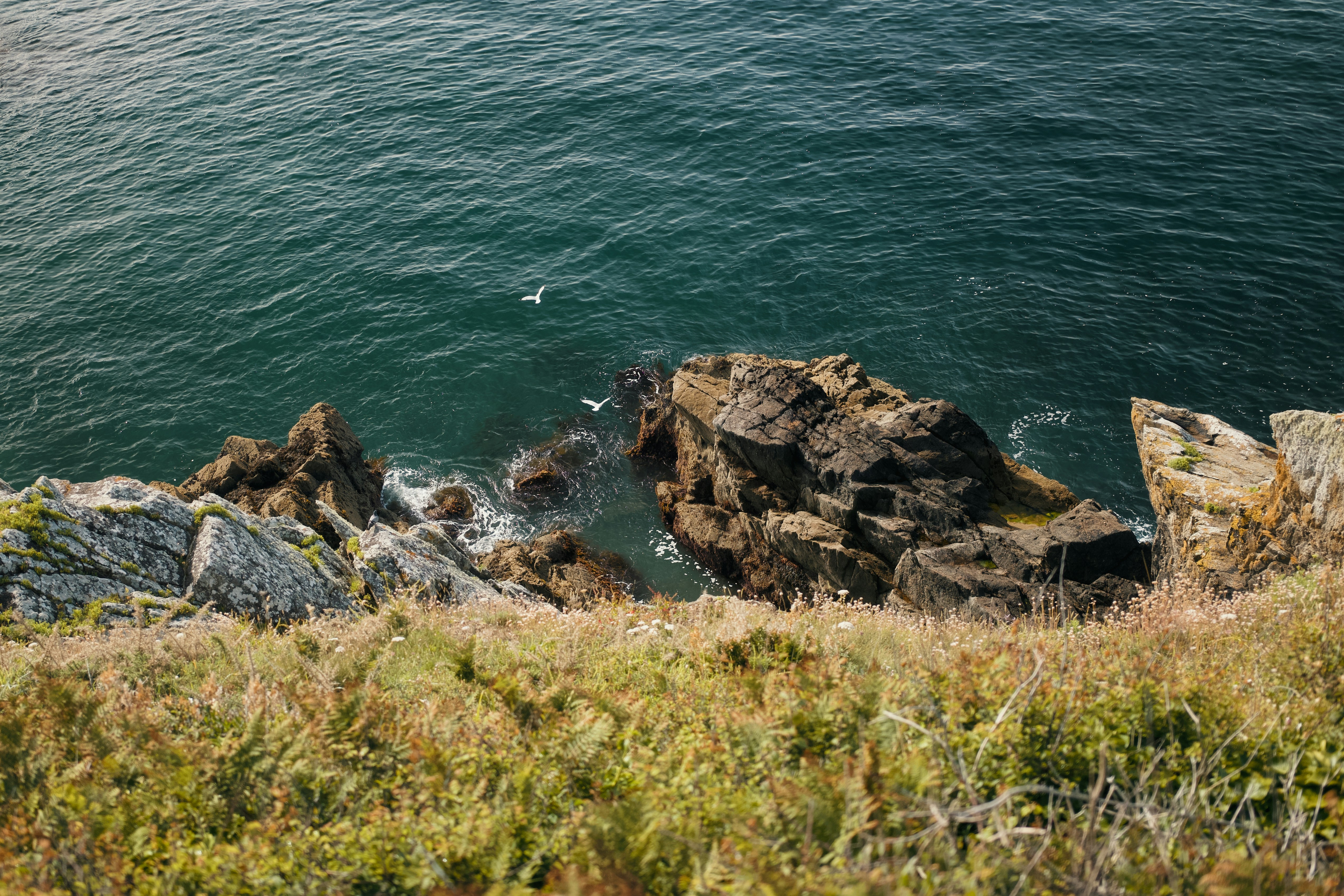 Cliffside Verge Over Turquoise Waves