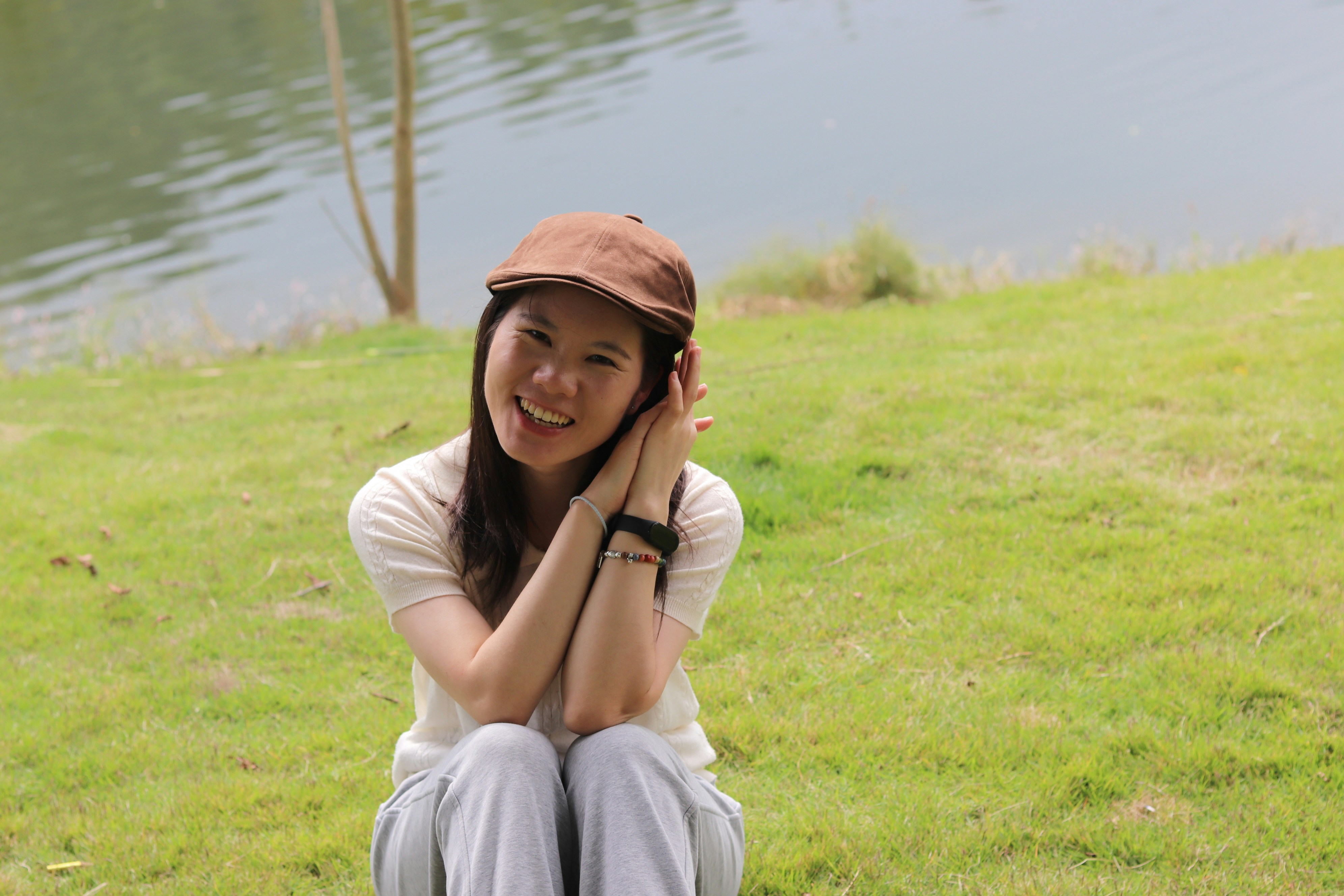 Smiling Moment by the Lake: A Riverside Portrait