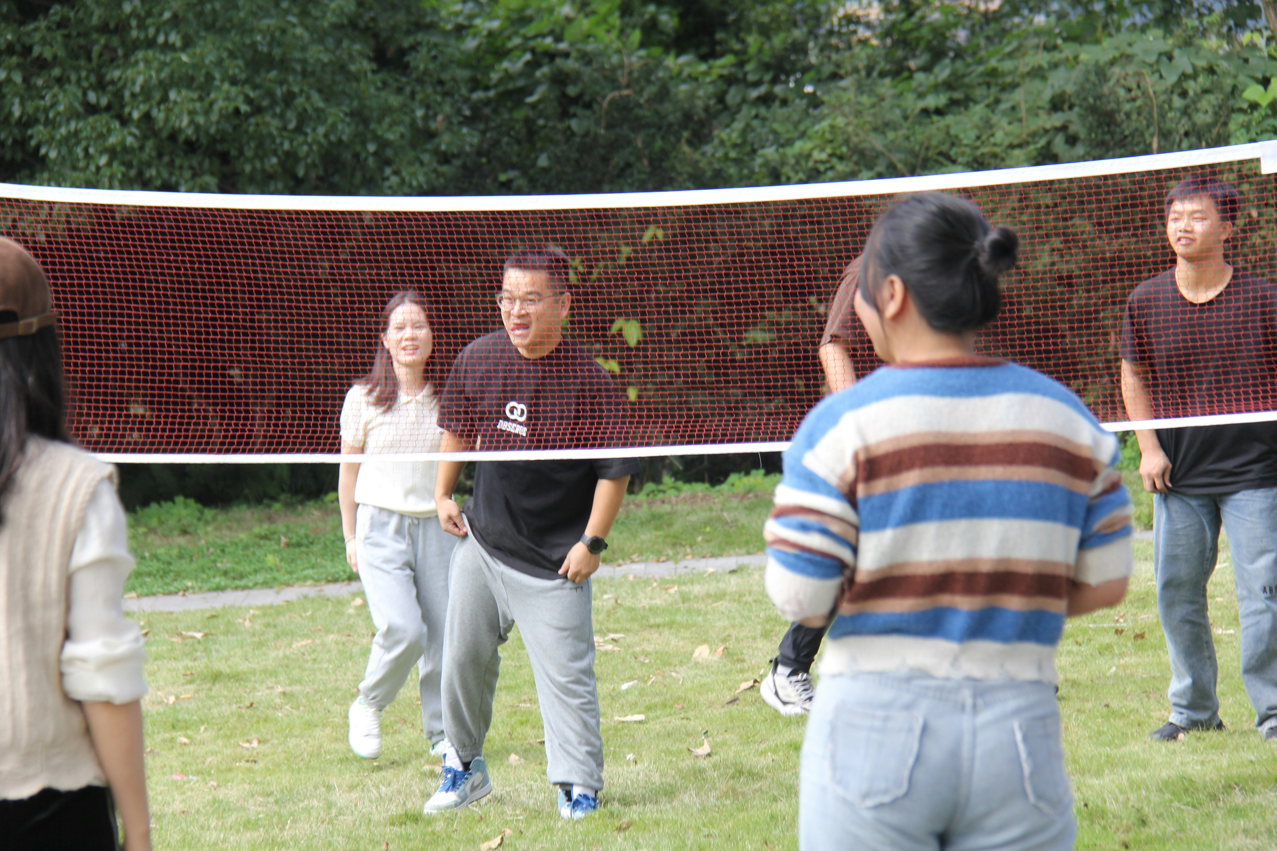 Midplay on the Court: Friends Gathered for a Casual Outdoor Volleyball