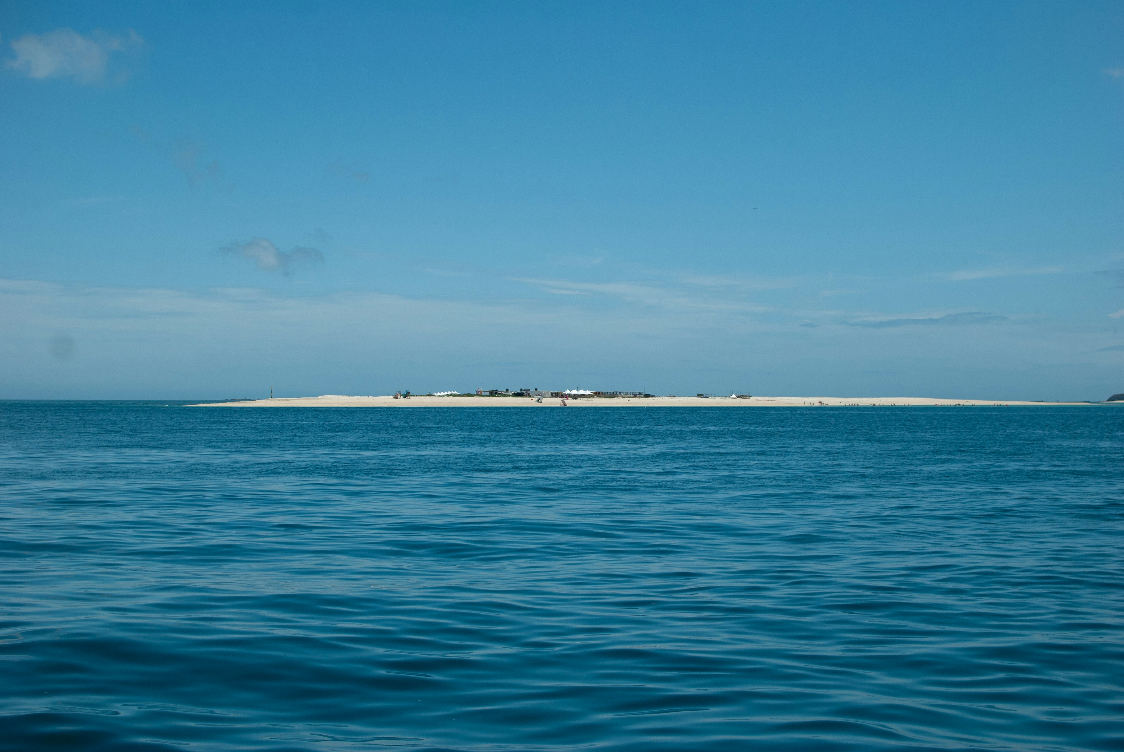 Blue Horizon: A Quiet Seascape of Distant Sandbar